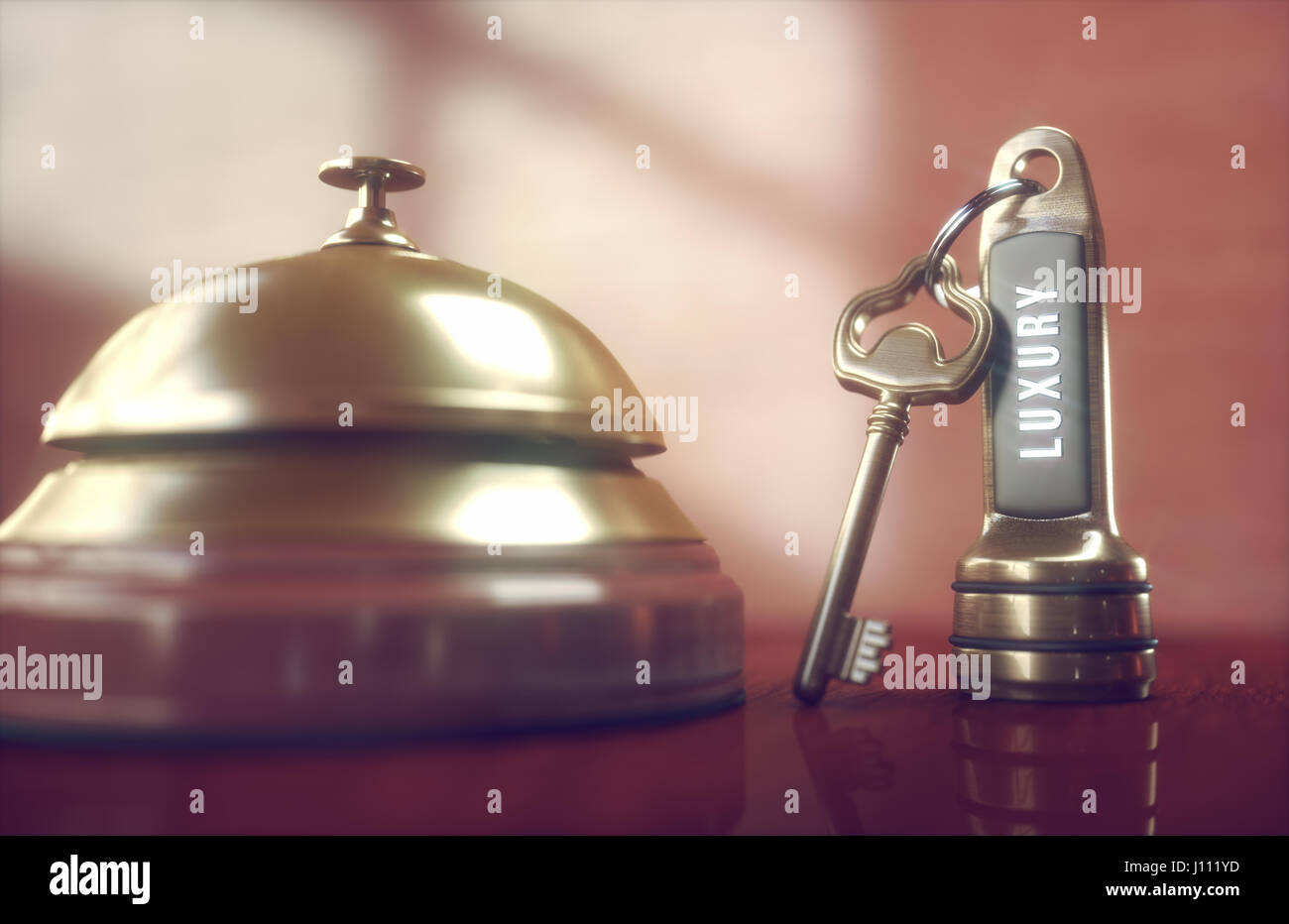 Luxury hotel key and vintage golden bell on the wooden table of the ...