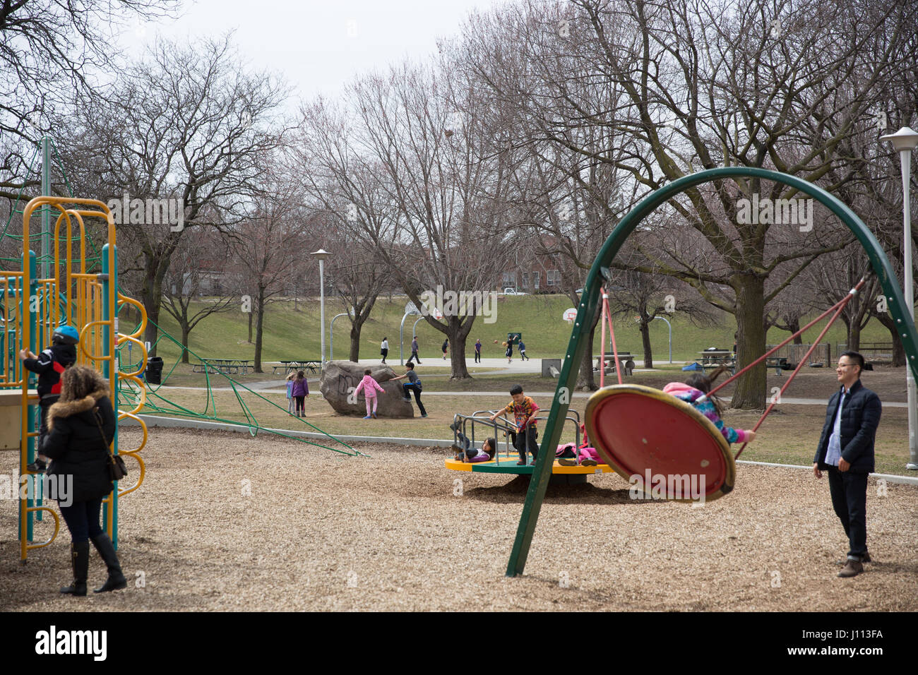 TORONTO, CANADA: Kids and adults play at Christie Pits Park in Toronto ...