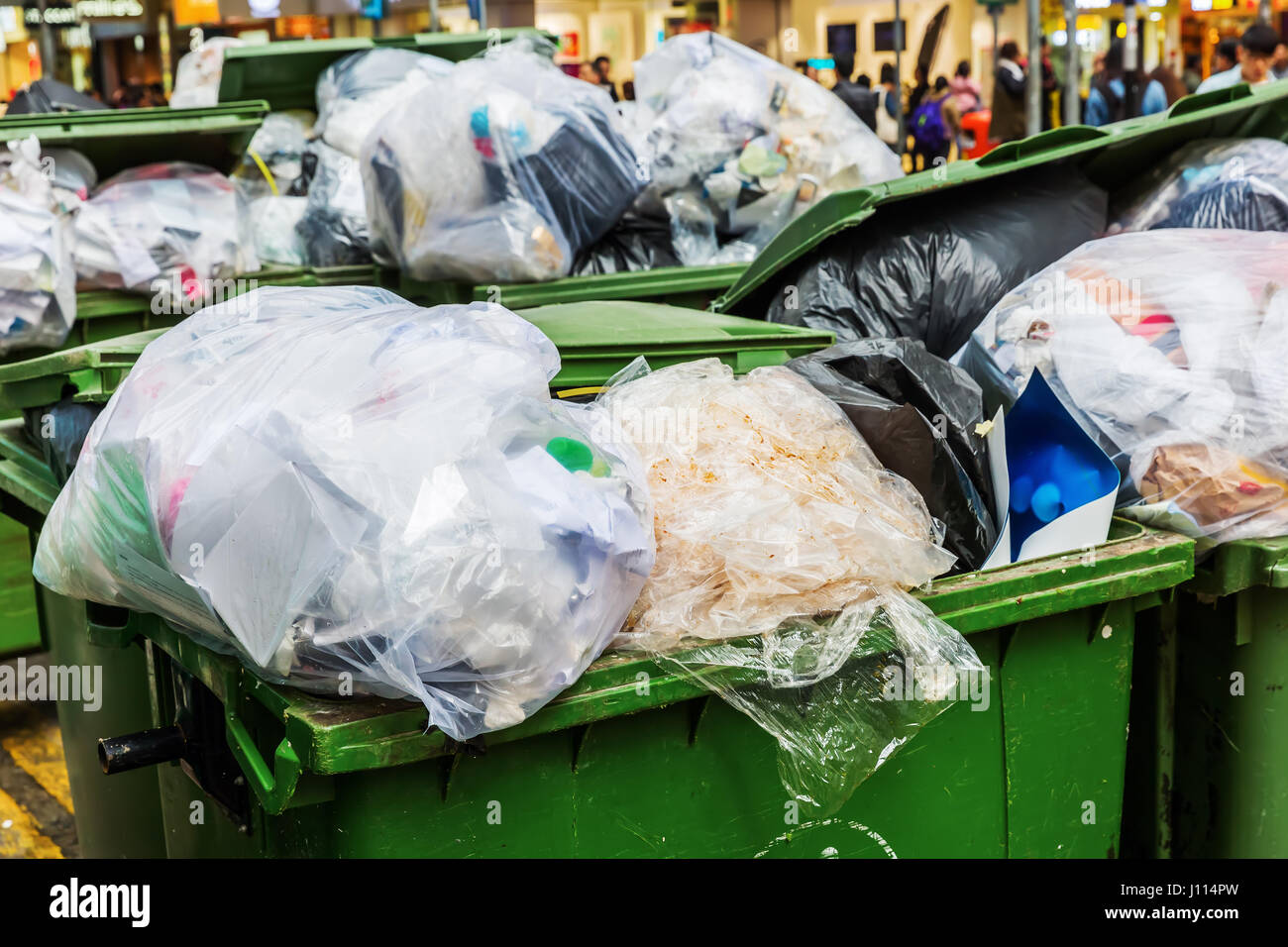 picture of a lot of filled green waste containers Stock Photo - Alamy