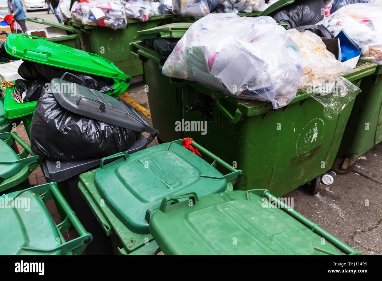 picture of a lot of filled green waste containers Stock Photo - Alamy