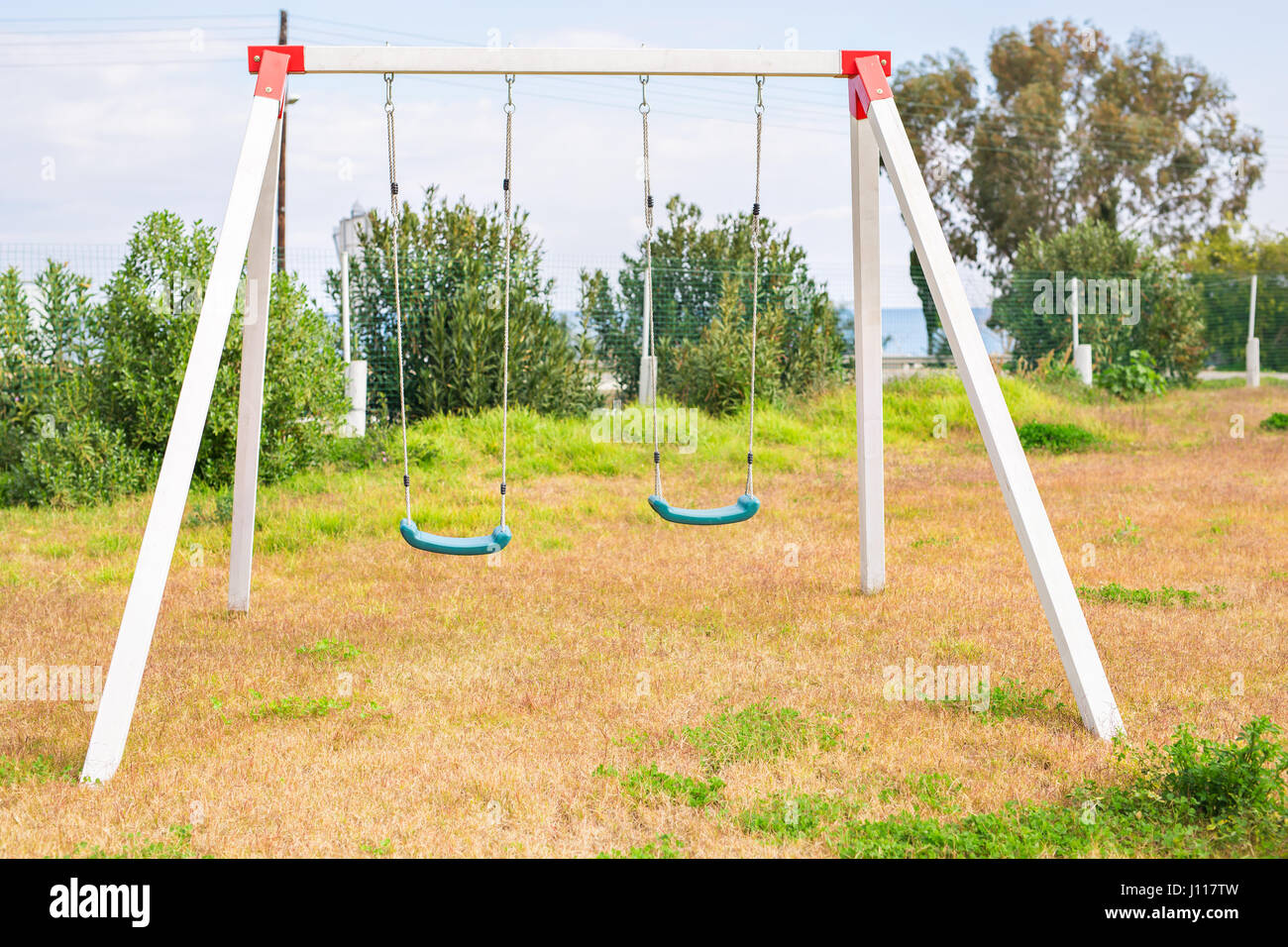 Children swing at Playground Stock Photo - Alamy