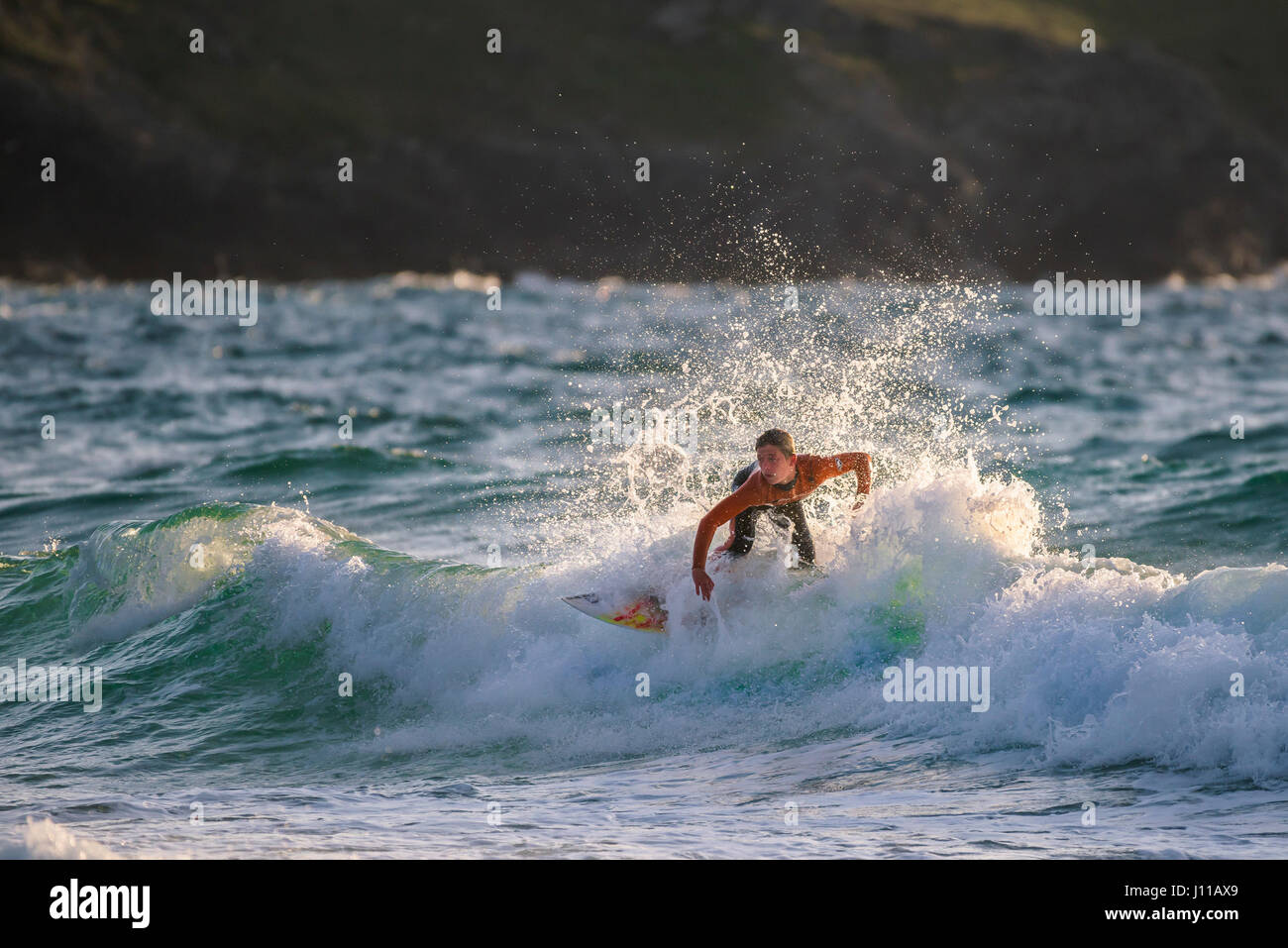 Surfing UK. Spectacular action as a surfer rides a wave at Fistral ...