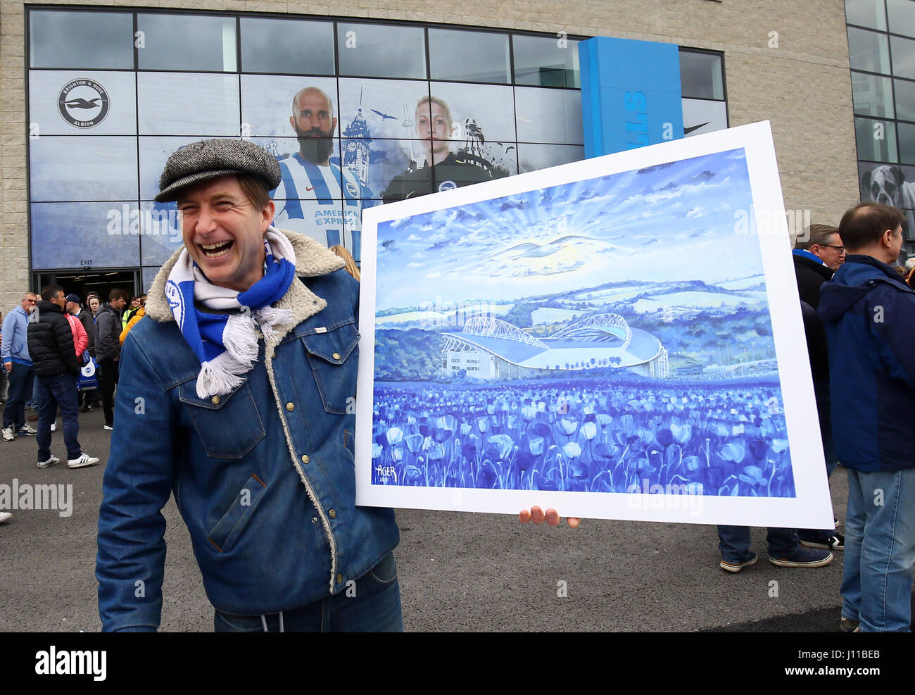 Artist Danny Ager with a painting of the AMEX Stadium before the Sky ...