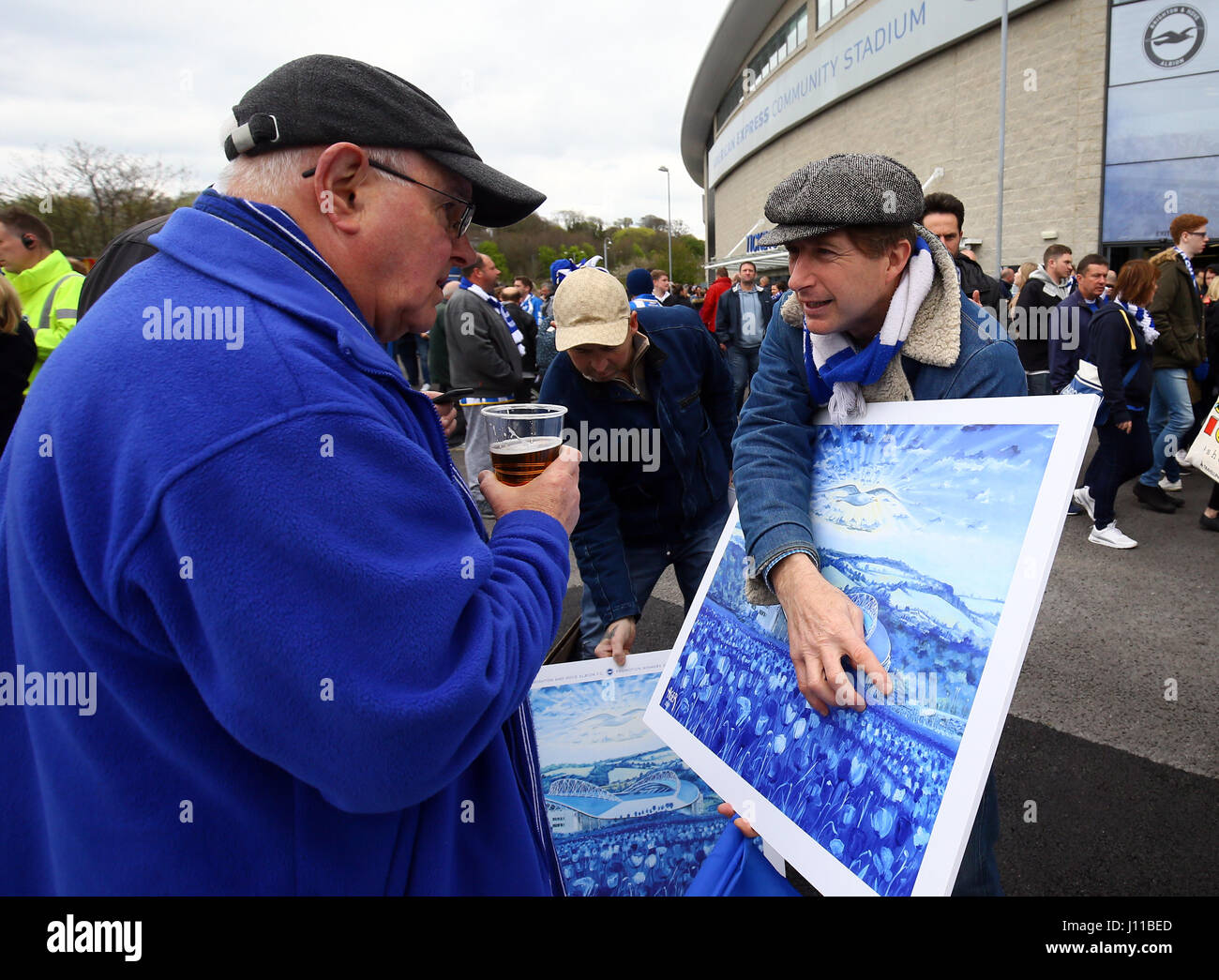 Artist Danny Ager with a painting of the AMEX Stadium before the Sky ...