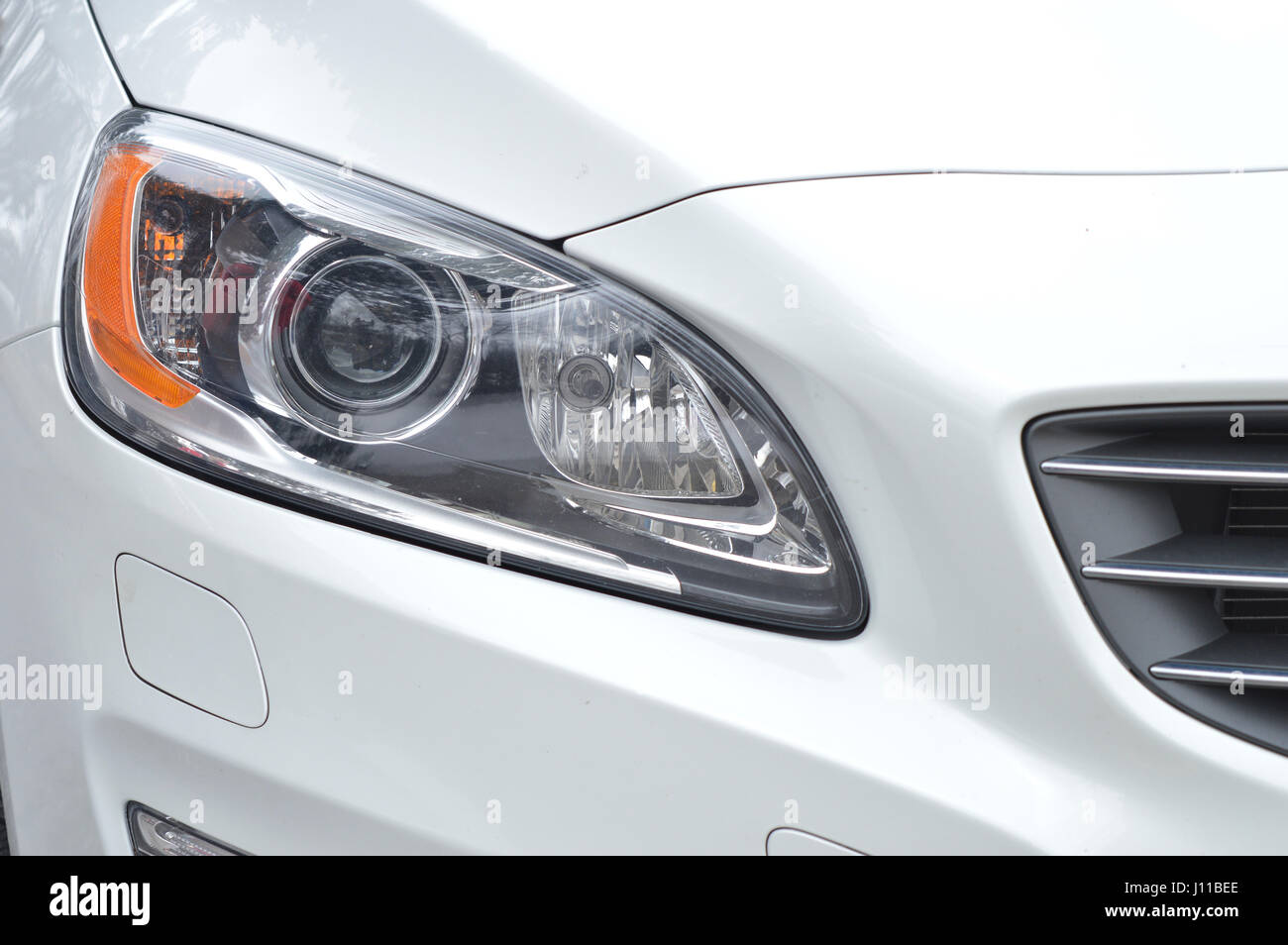 front passenger side headlight of a new car Stock Photo - Alamy