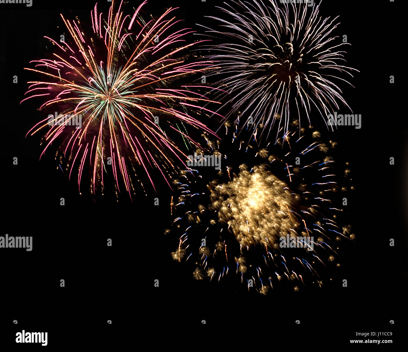 MULTIPLE COMPLETE SMOKELESS FIREWORK BURSTS ON CLEAR BLACK SKY Stock ...