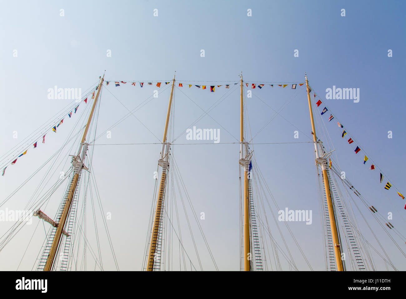 Low Angle View Of Tall Ship Mast Against Clear Blue Sky Stock Photo - Alamy