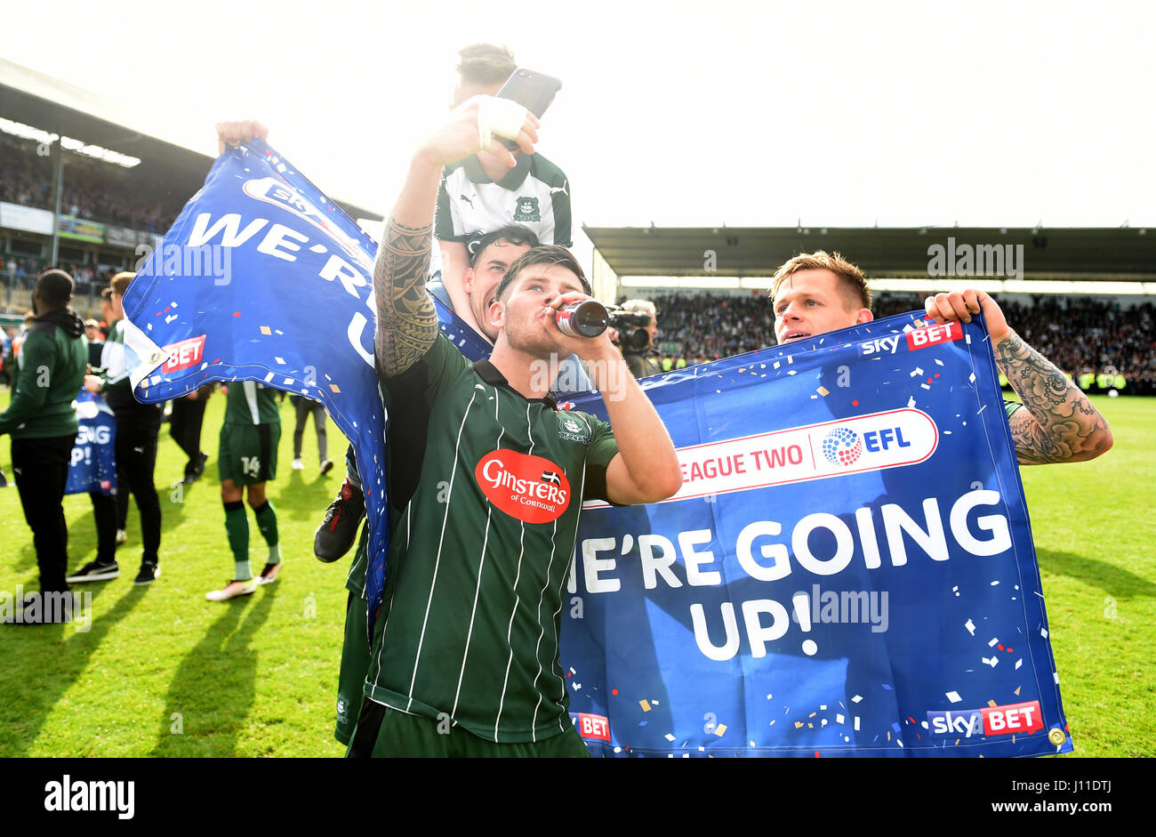 Plymouth Argyle players celebrate on the pitch after the final whistle of the Sky Bet League Two ...