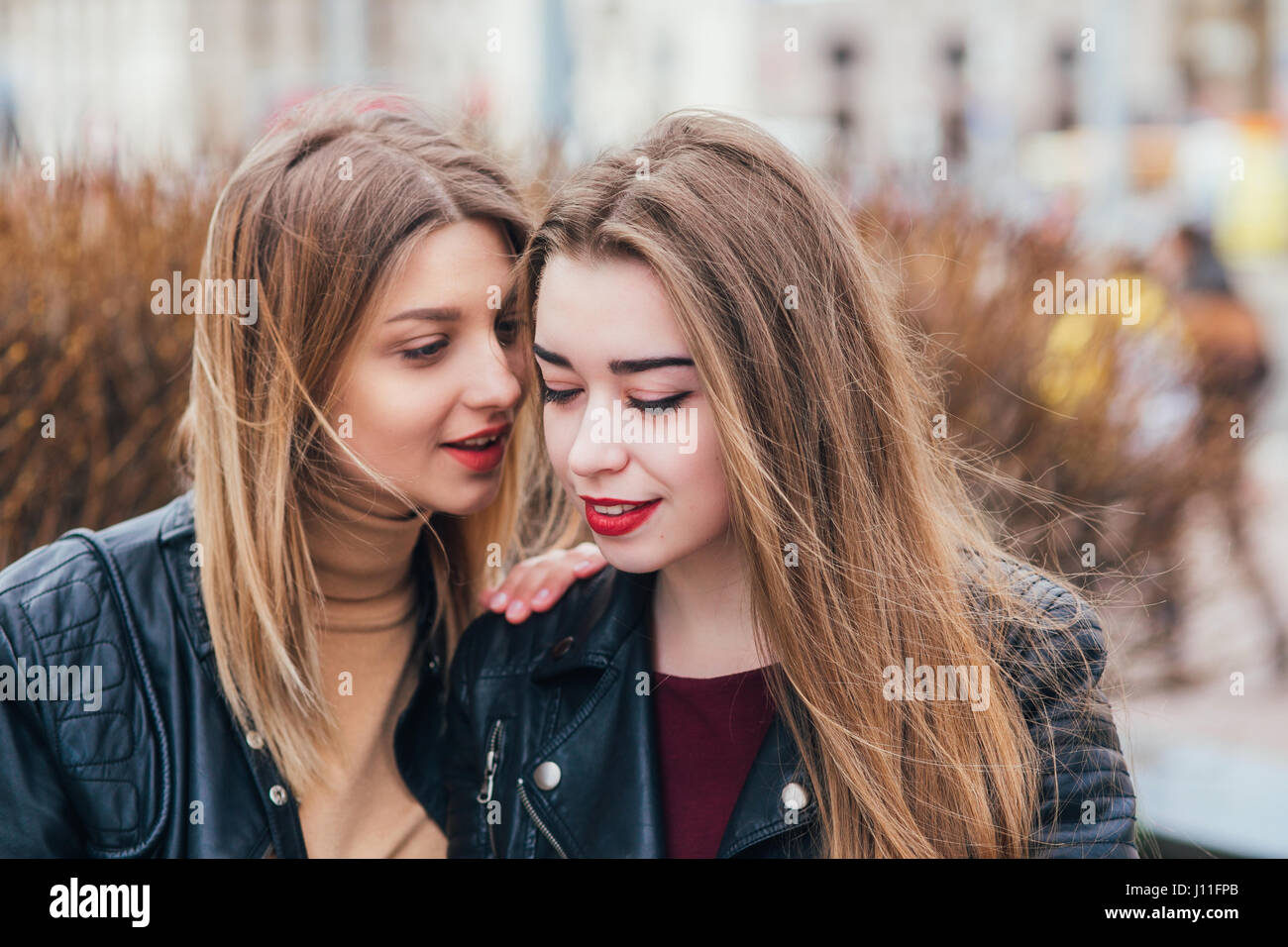Friendship . Two Women Talking in the City Stock Photo - Alamy