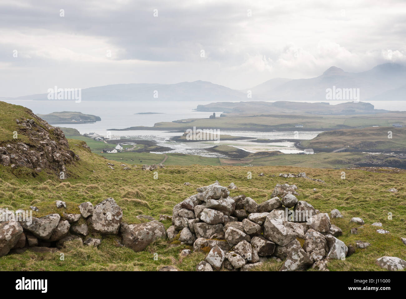 View from Canna Island of isolated houses and the island of Sanday ...