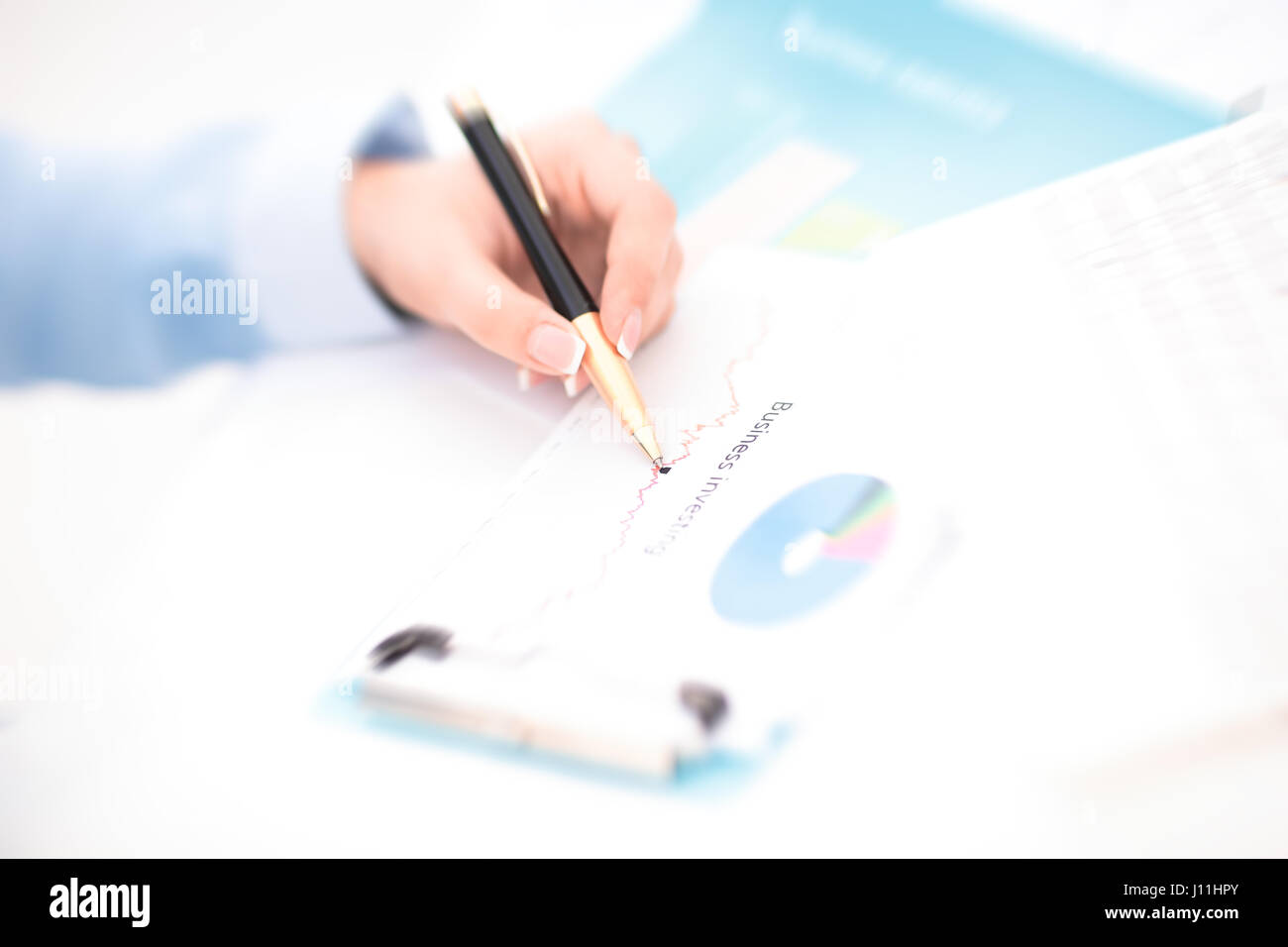 Woman hand signing a contract Stock Photo - Alamy