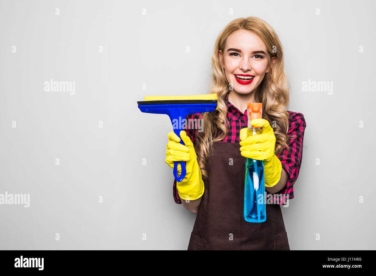 portrait of Attractive young woman cleaning windows Stock Photo - Alamy