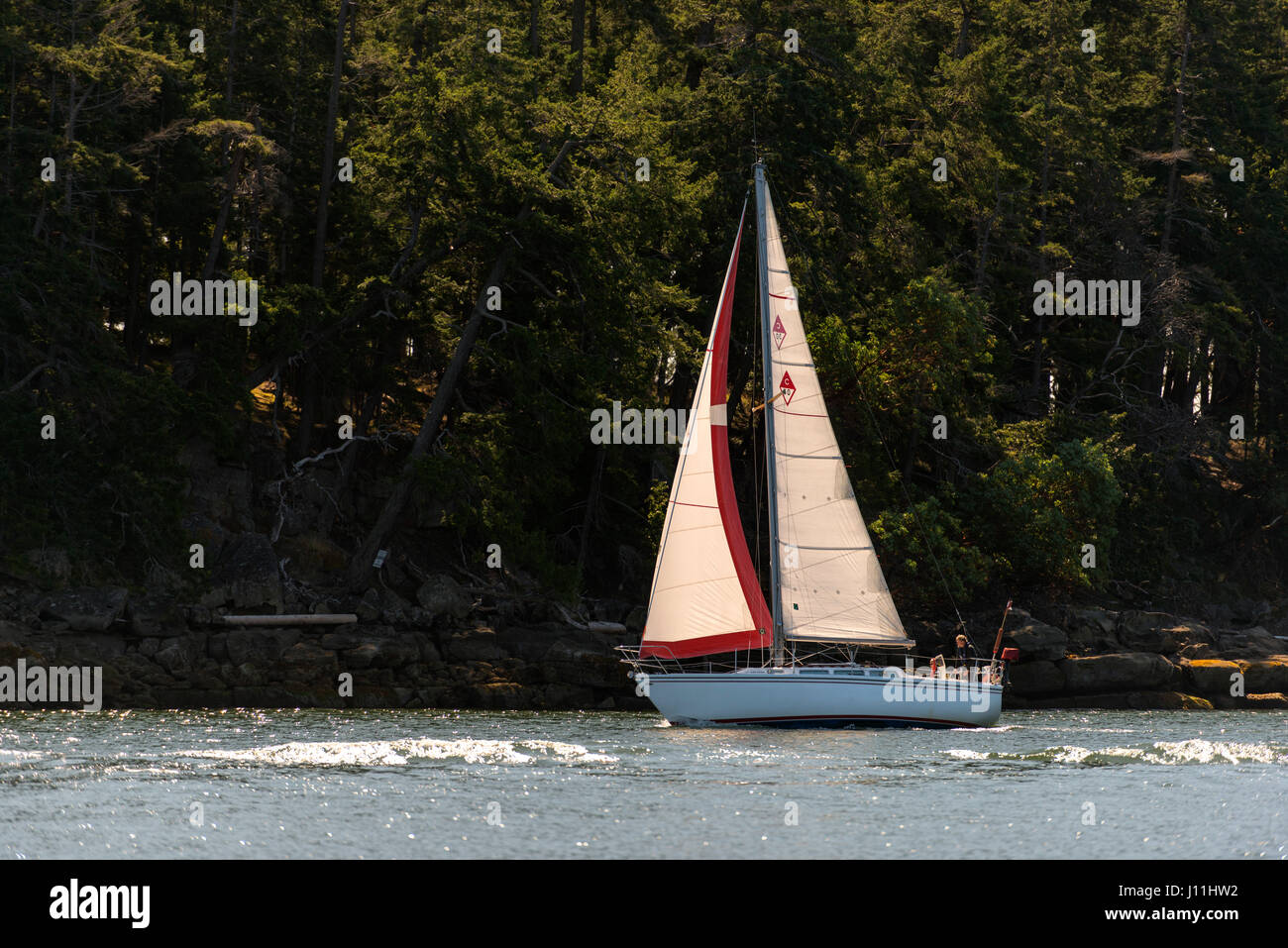 Sailing by an Island Stock Photo - Alamy