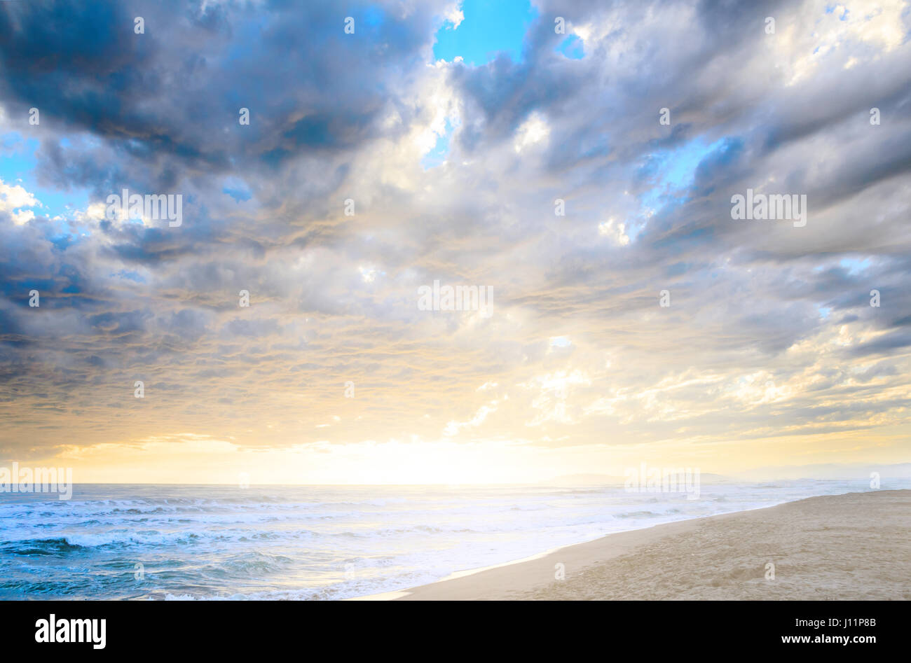 Cloudy sea sunset Stock Photo - Alamy