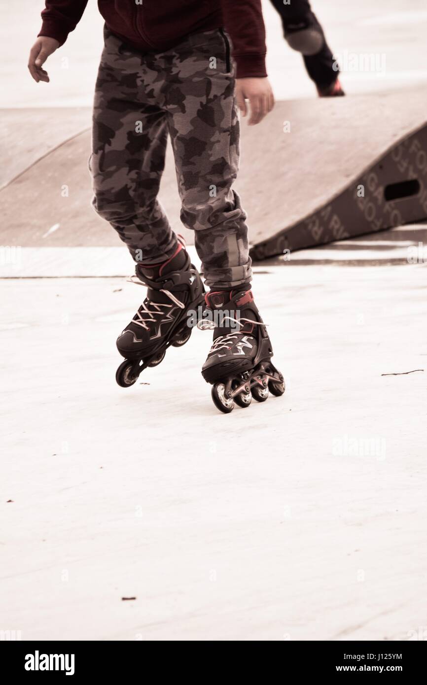 Boy inline skating hi-res stock photography and images - Alamy