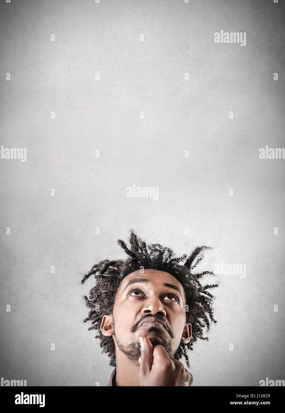 Young black man looking up Stock Photo - Alamy