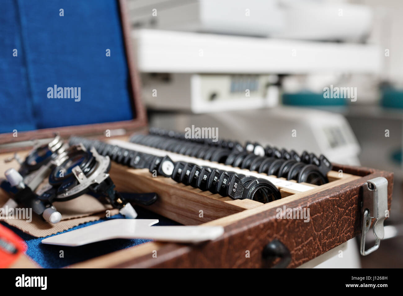 closeup of ophthalmic glasses for vision testing and set of lenses ...