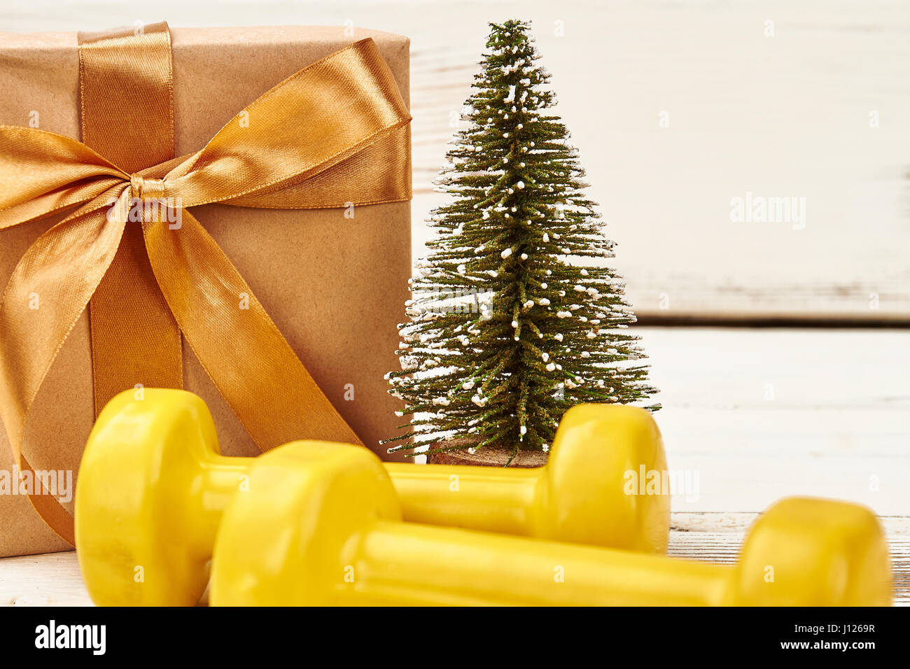 Dumbbells, Christmas tree and box Stock Photo - Alamy