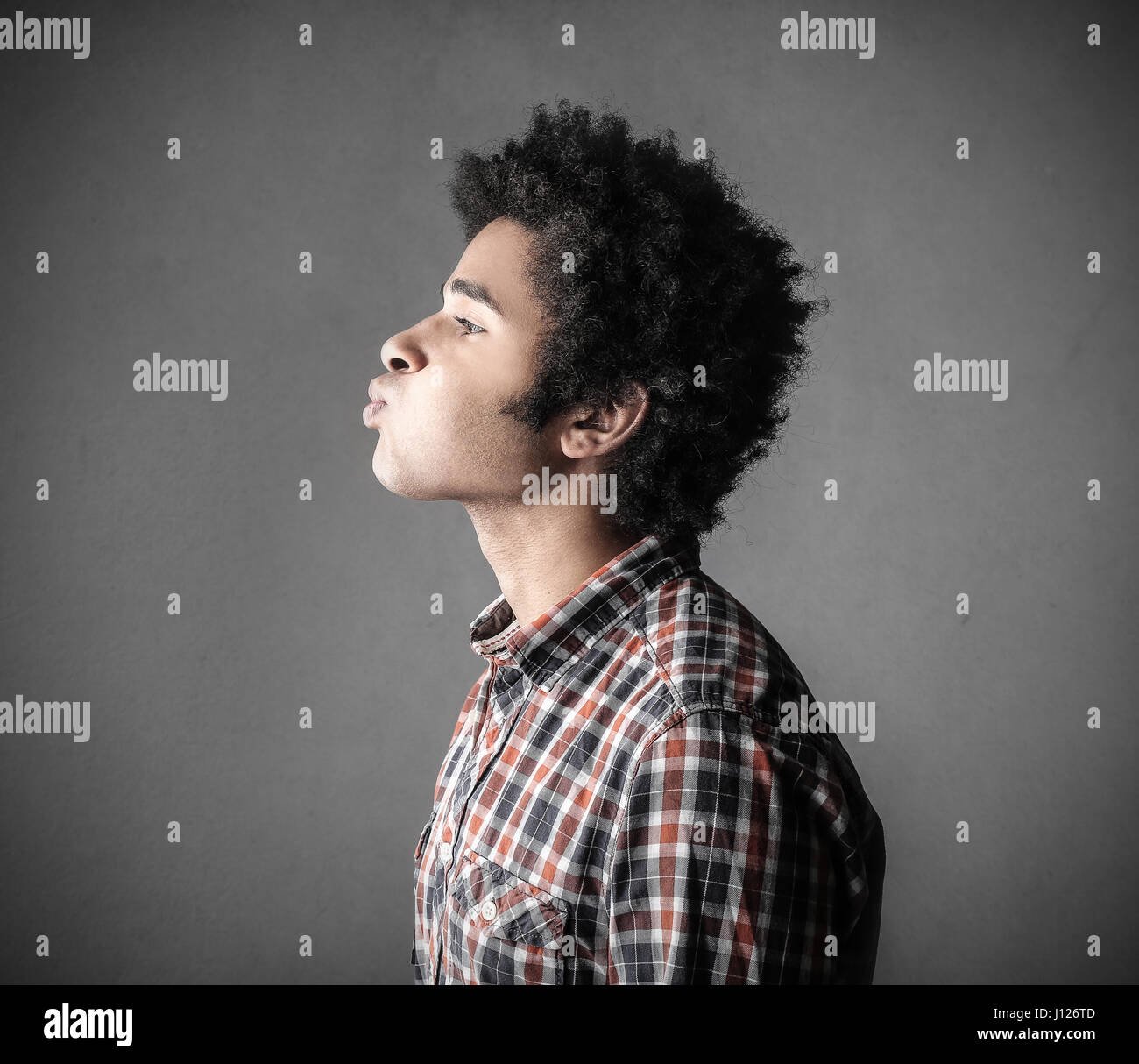 Young man from profile Stock Photo - Alamy