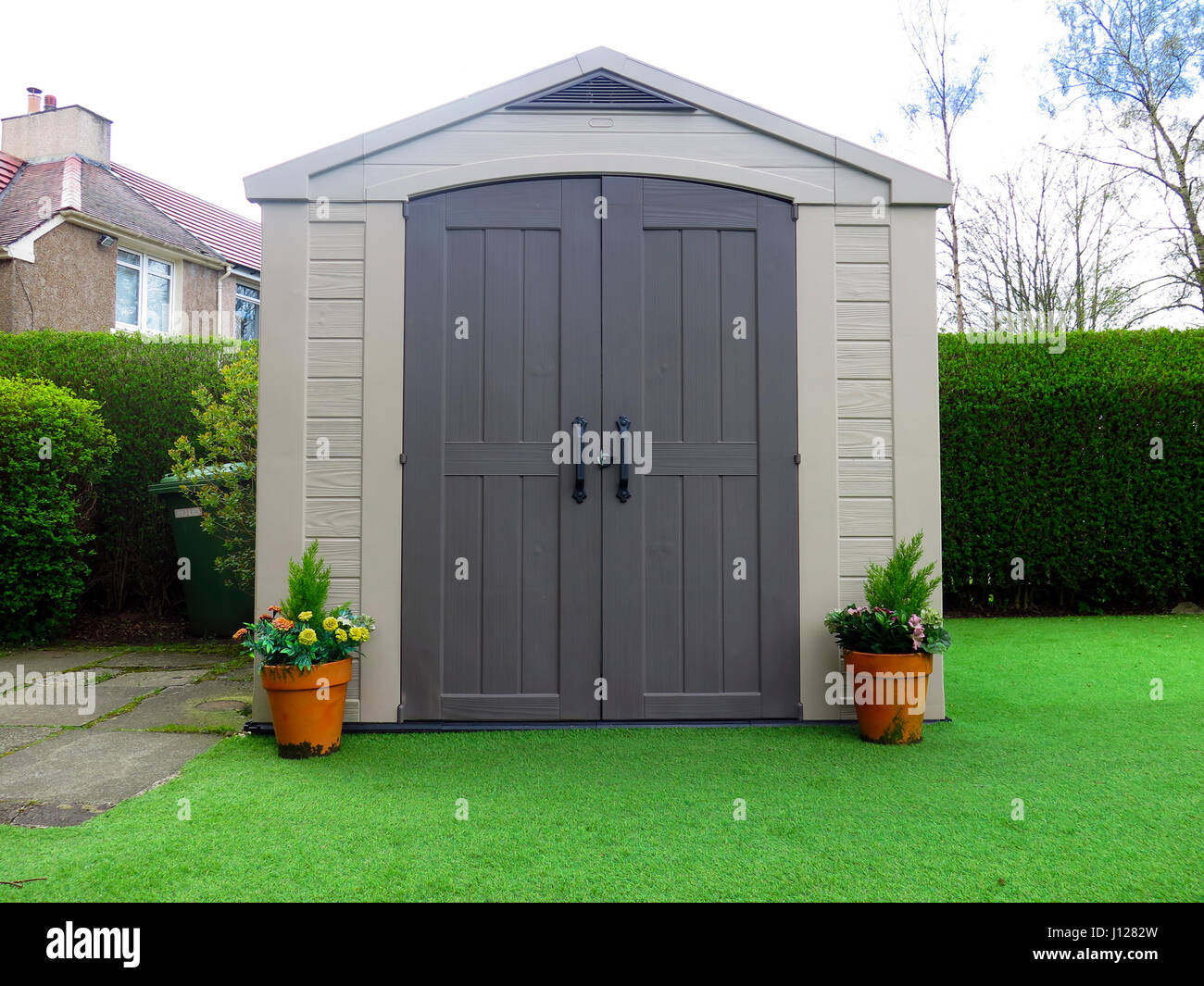 Plastic garden shed Stock Photo - Alamy