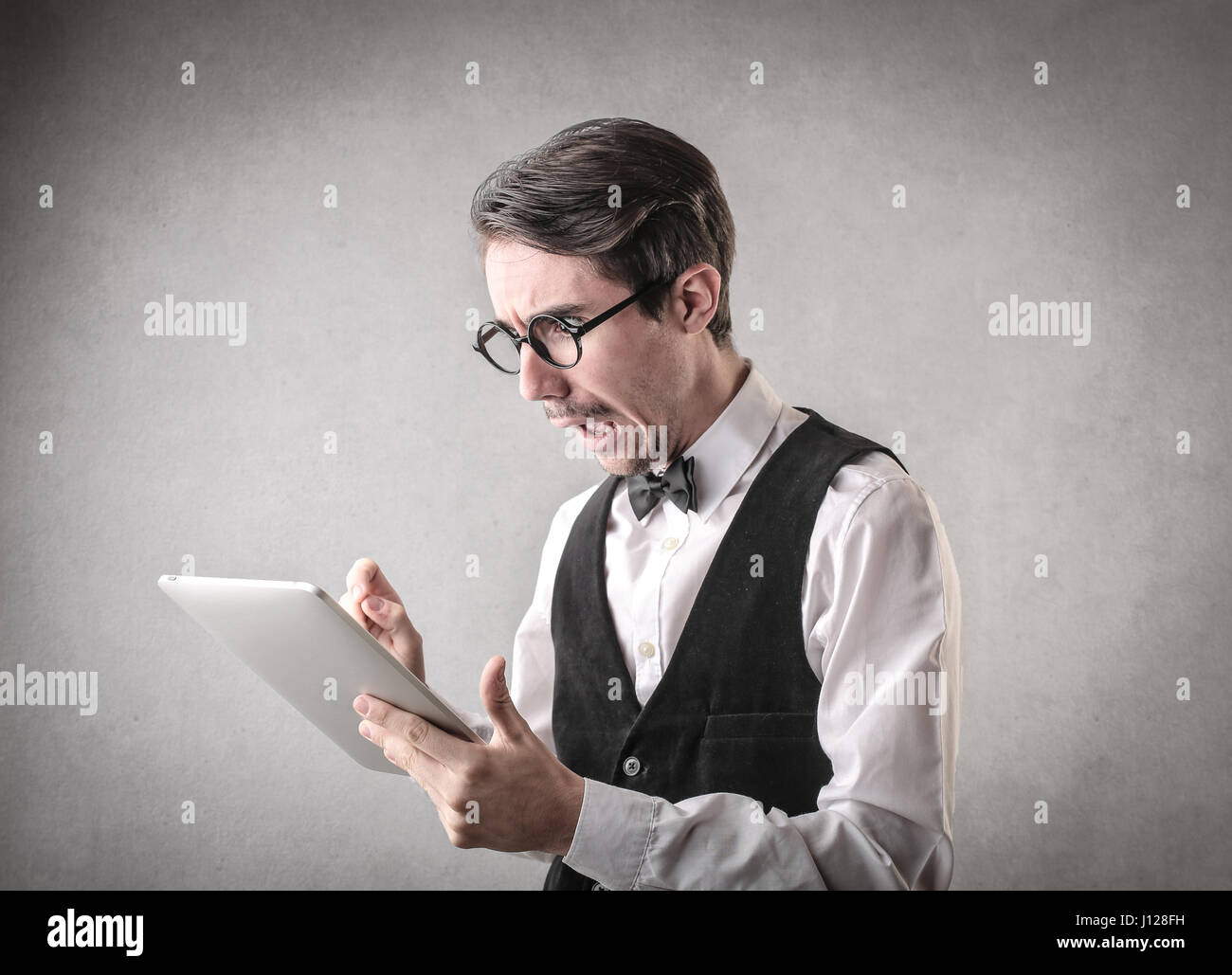 Elegant man with tablet Stock Photo - Alamy