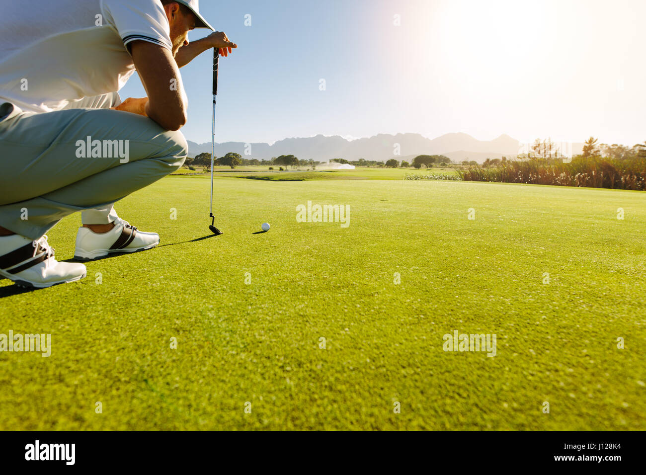 Golf player stick hi-res stock photography and images - Alamy