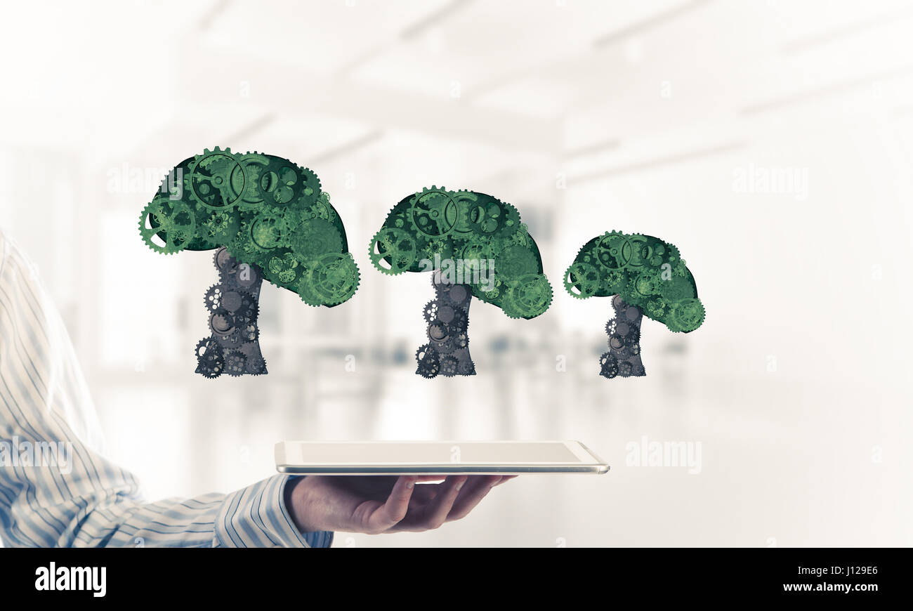 Eco green environment concept presented by tree as working mecha Stock ...