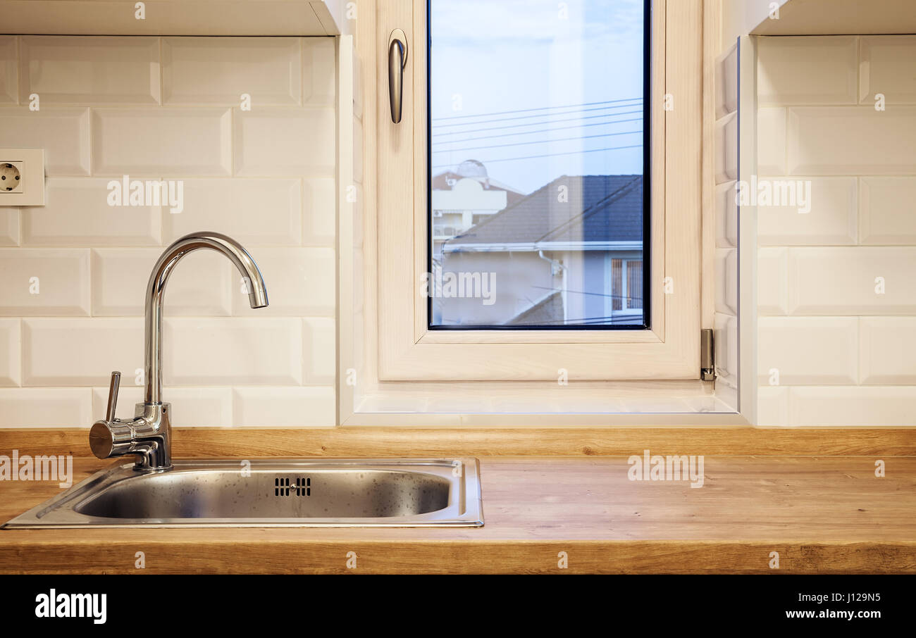 Structure of a modern small kitchen, faucet and desk surface Stock ...