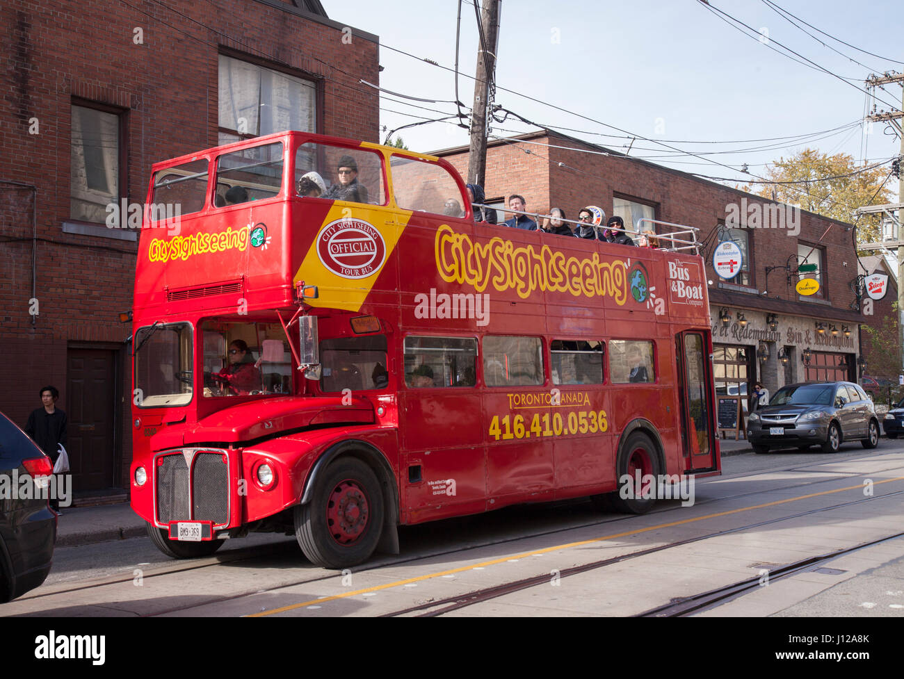 TORONTO,CANADA-NOVEMBER 01,2016: Red double decker tour bus. Several ...