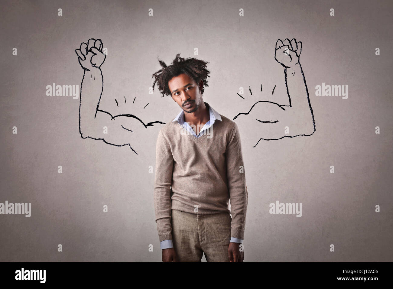 Black man with drawn muscular arms Stock Photo - Alamy