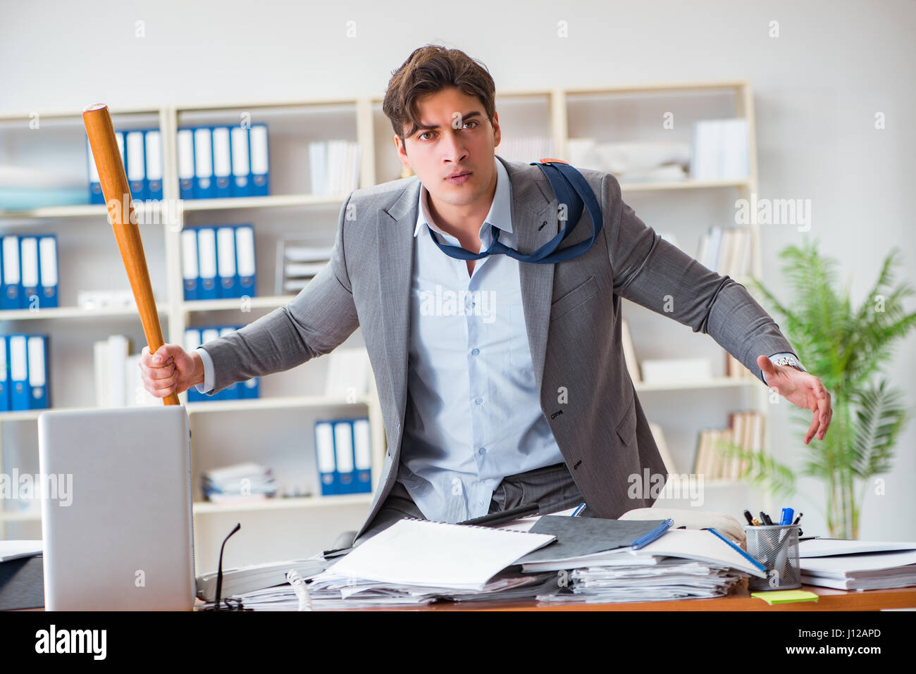 Angry aggressive businessman in the office Stock Photo - Alamy