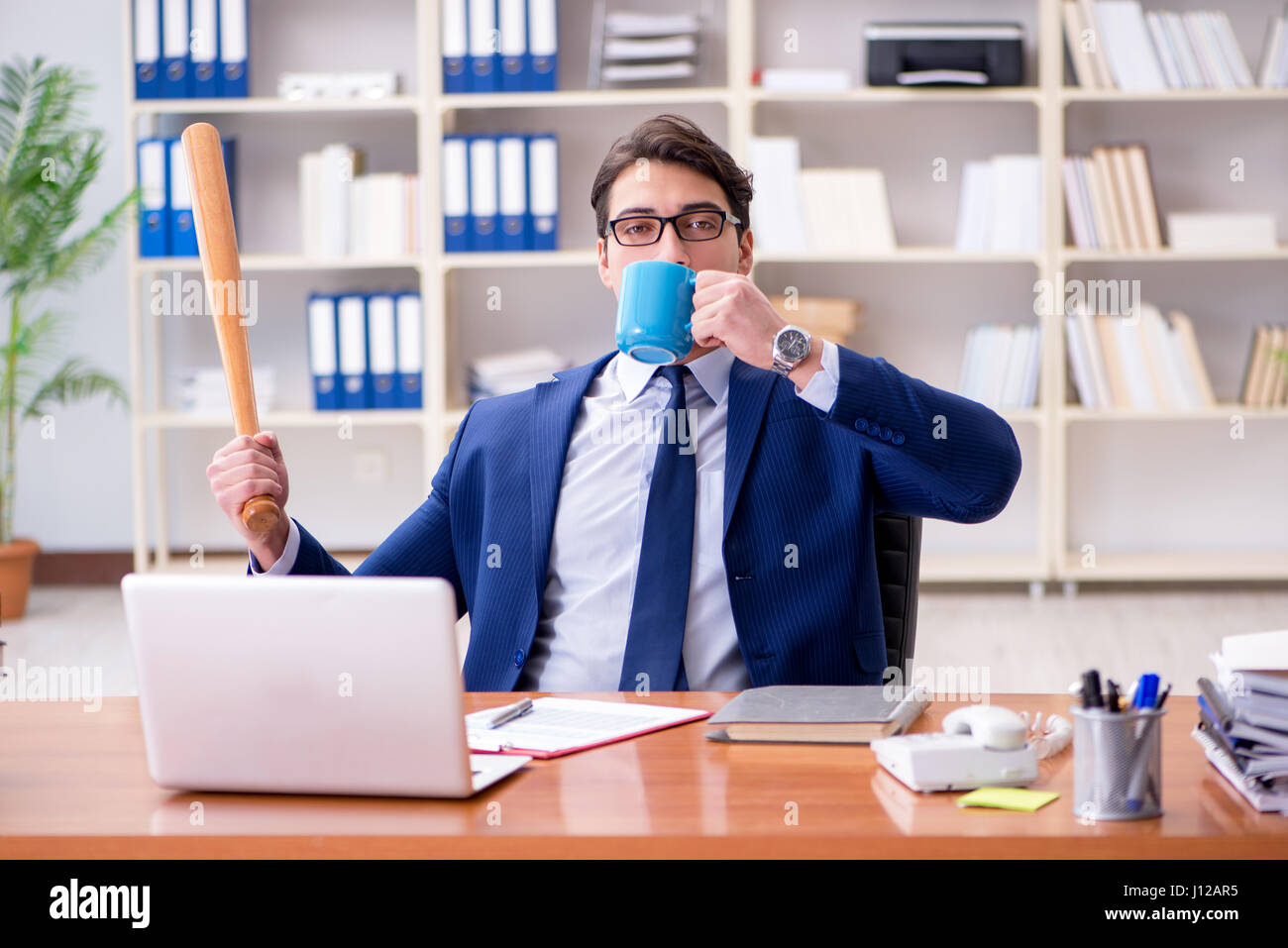 Angry aggressive businessman in the office Stock Photo - Alamy