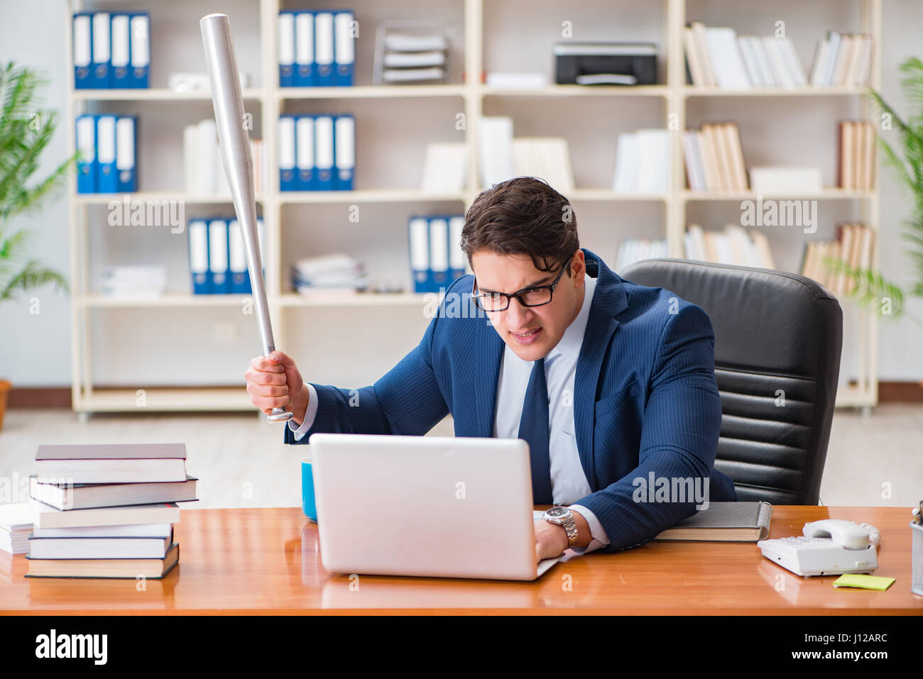 Angry aggressive businessman in the office Stock Photo - Alamy