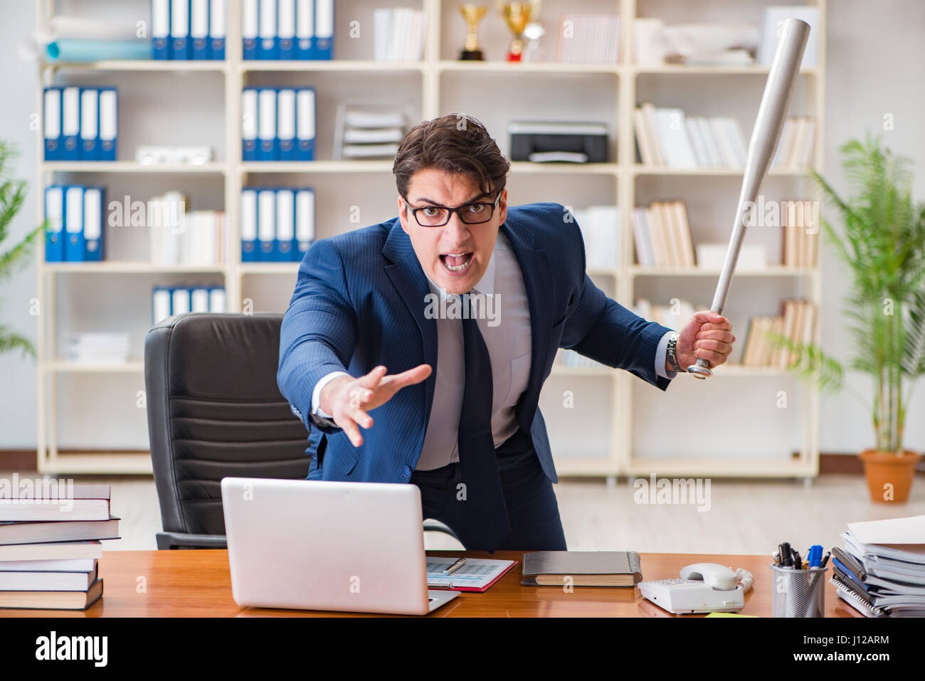 Angry aggressive businessman in the office Stock Photo - Alamy
