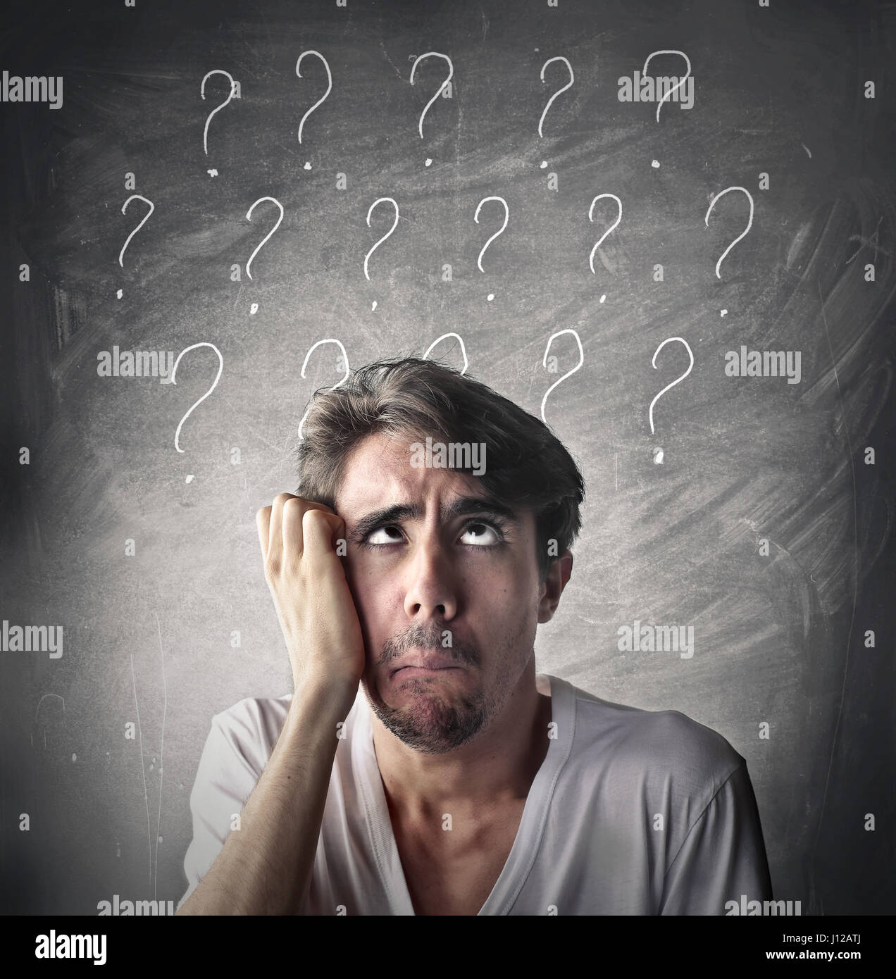 Man with questions Stock Photo - Alamy