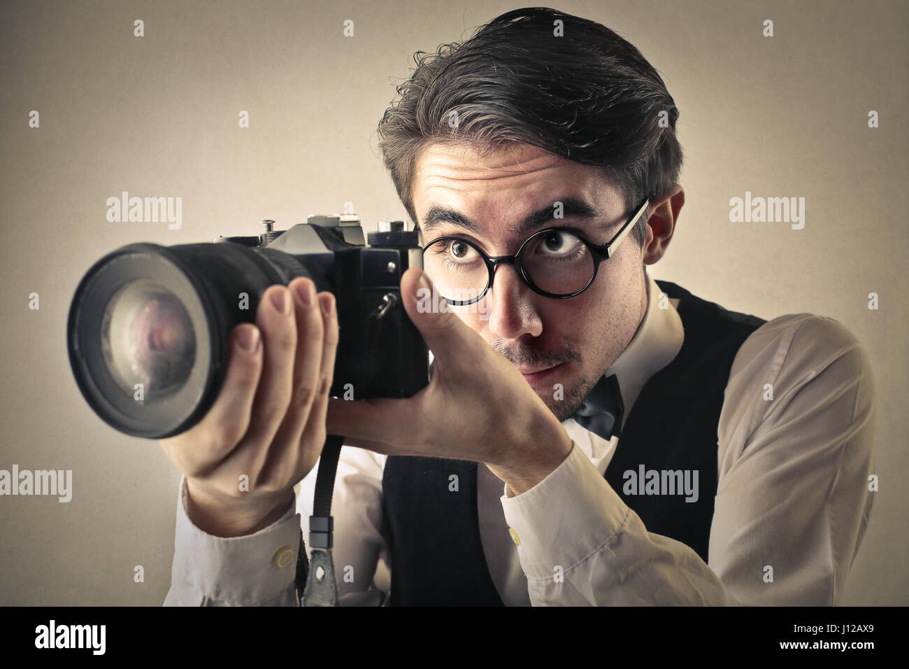 Photographer man with camera Stock Photo - Alamy