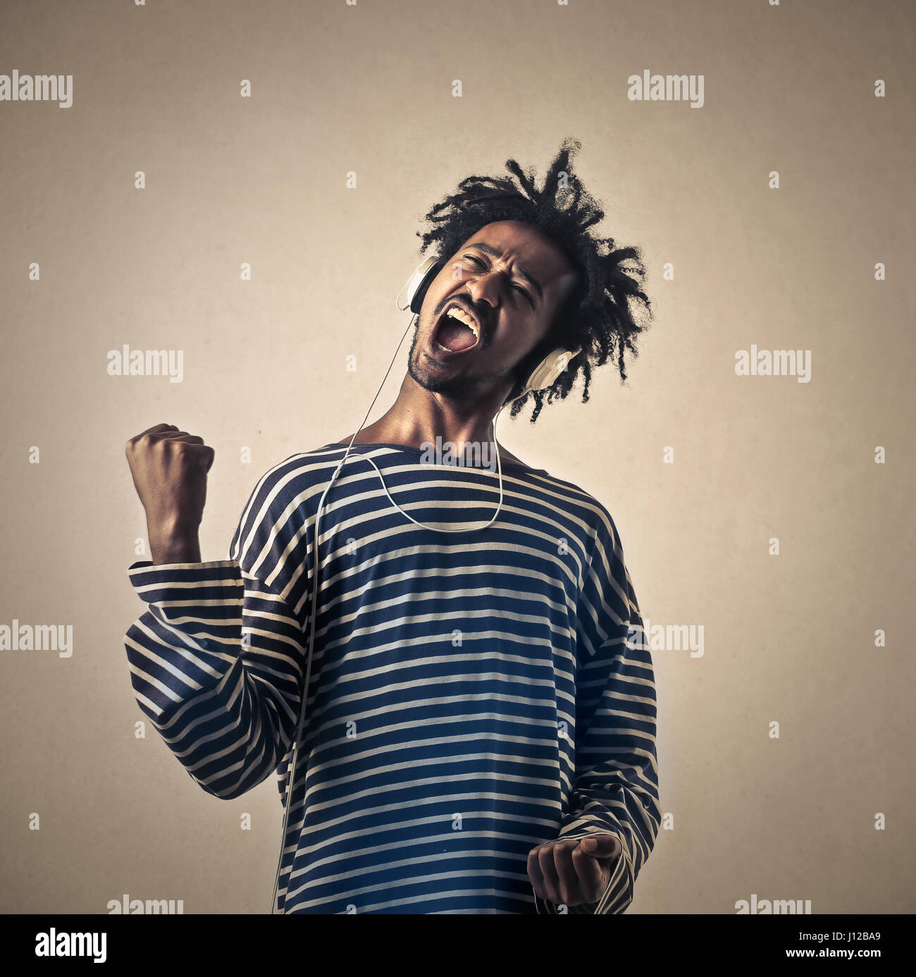 Black man feeling successful Stock Photo - Alamy
