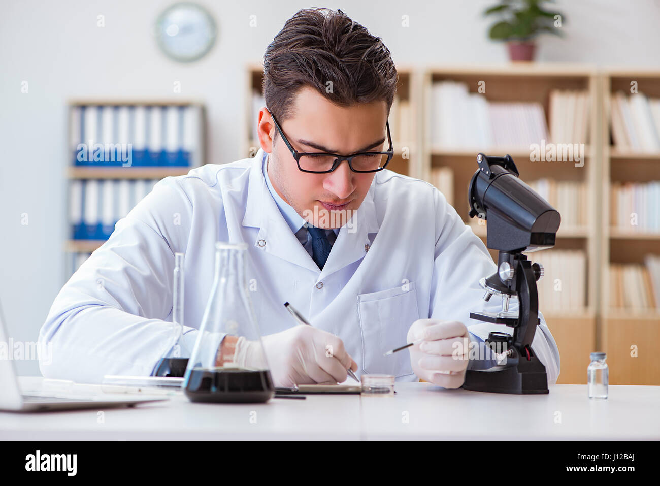 Chemical engineer working on oil samples in lab Stock Photo - Alamy