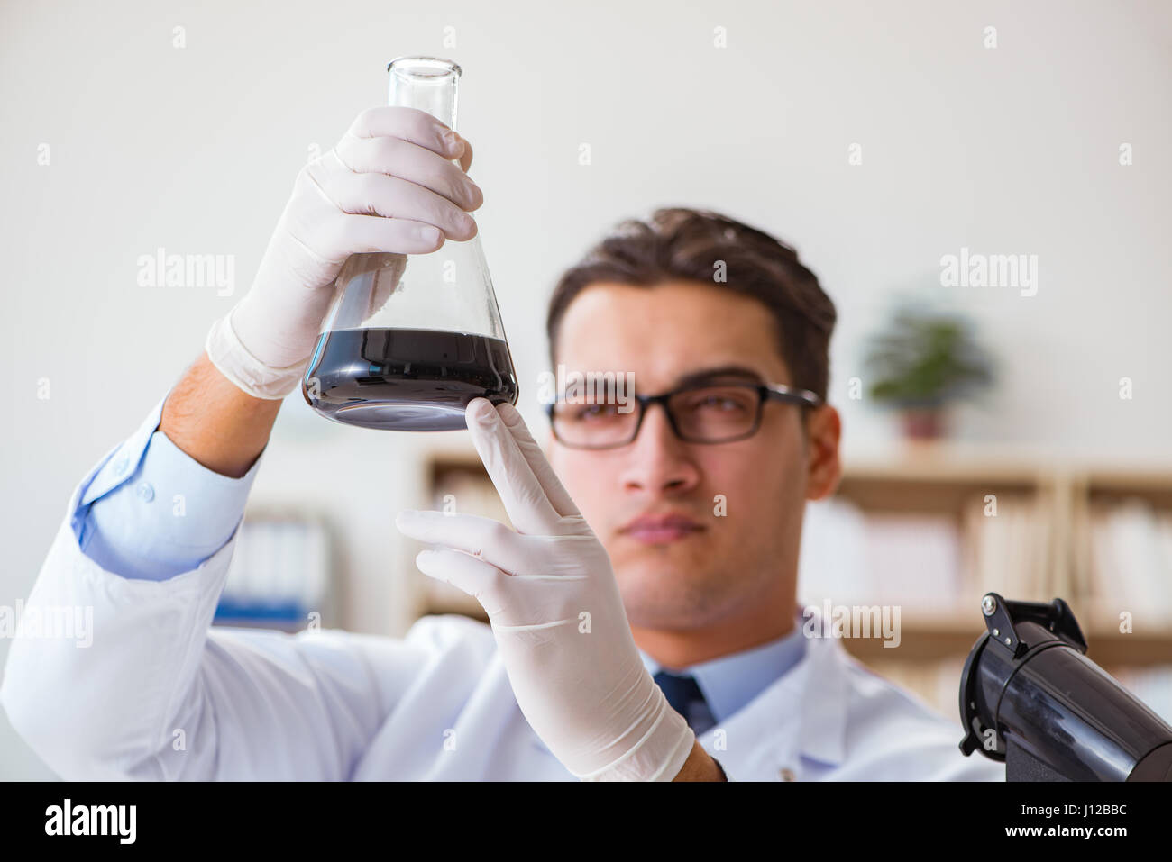 Chemical engineer working on oil samples in lab Stock Photo - Alamy