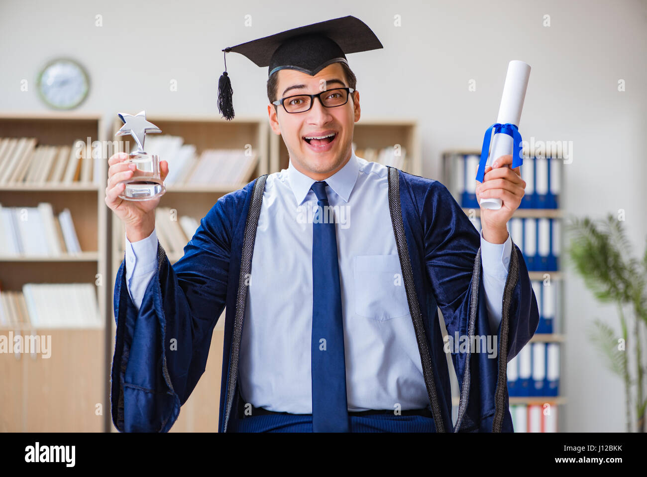 Young man graduating from university Stock Photo - Alamy