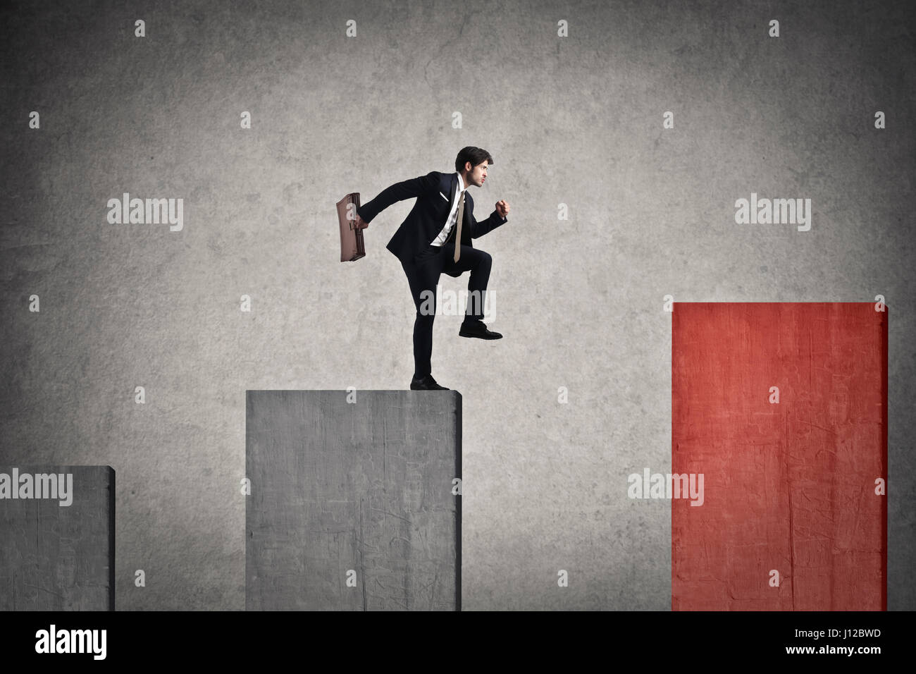 Businessman running on statistic Stock Photo - Alamy
