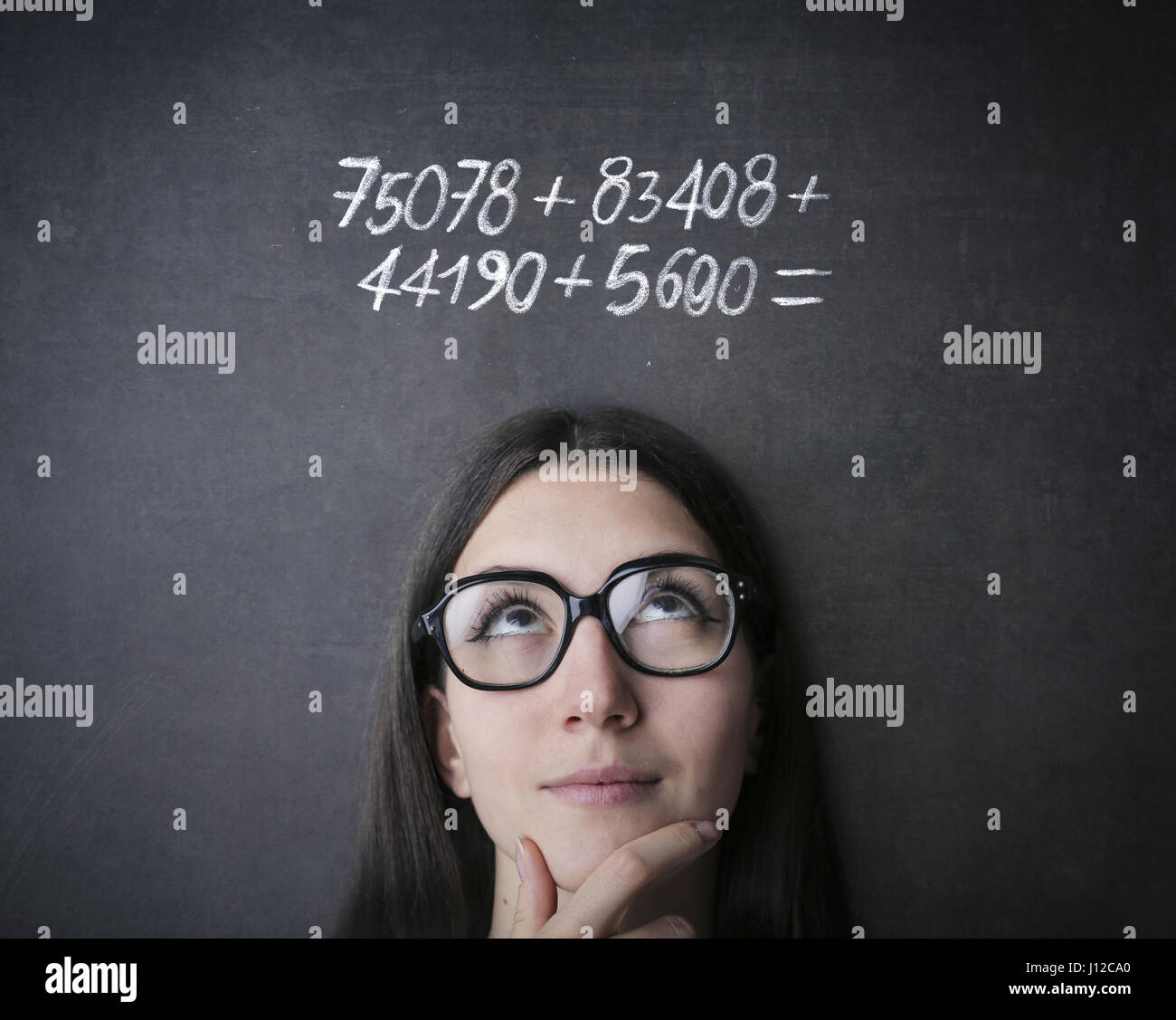 Young woman thinking on math Stock Photo - Alamy