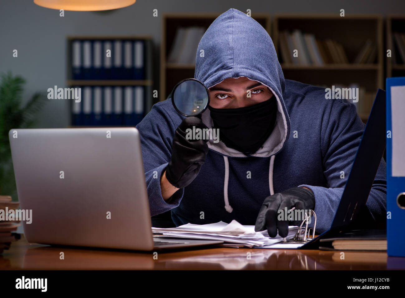 Hacker stealing personal data from home computer Stock Photo - Alamy