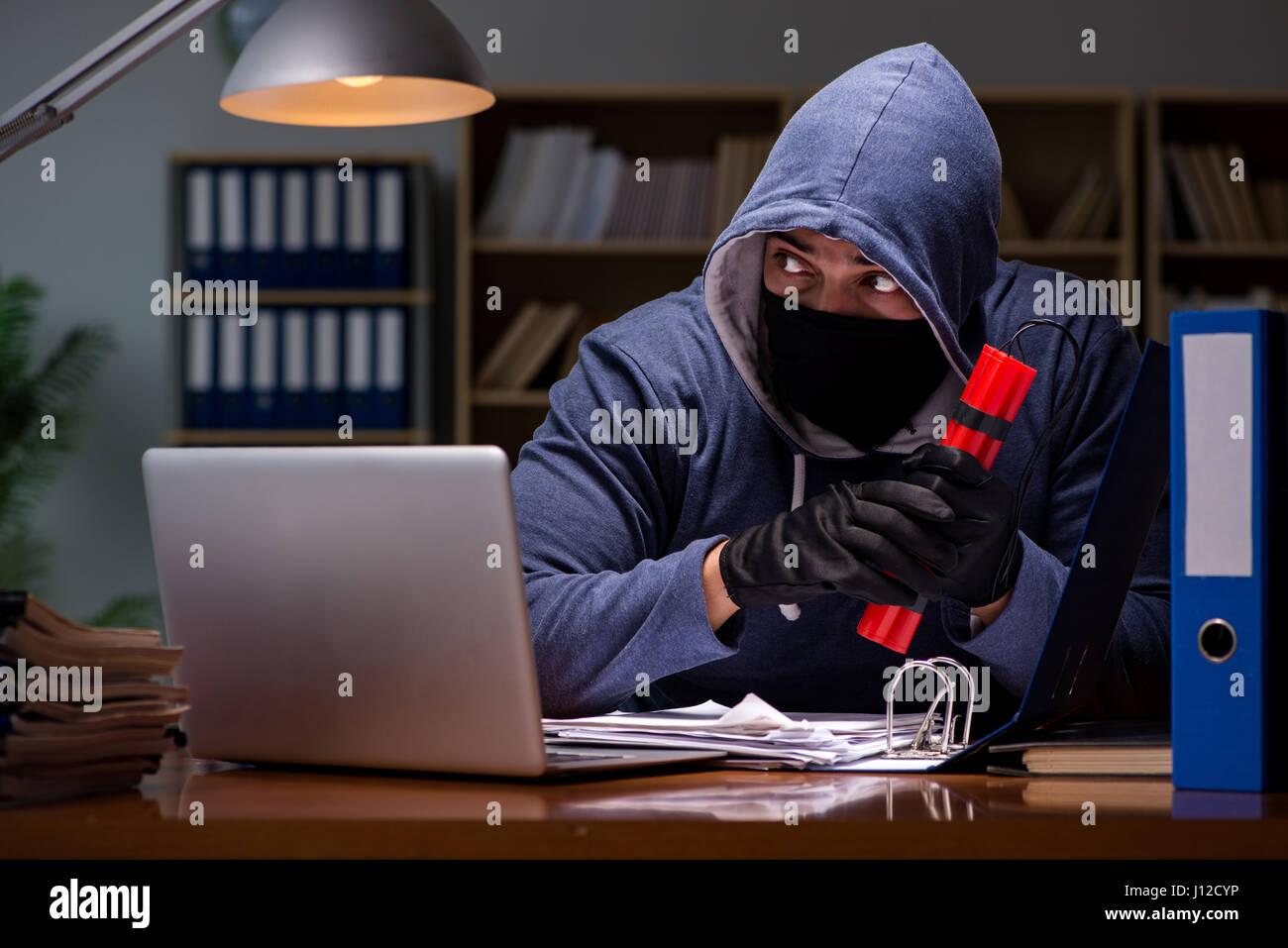 Hacker with dynamite stealing data Stock Photo - Alamy