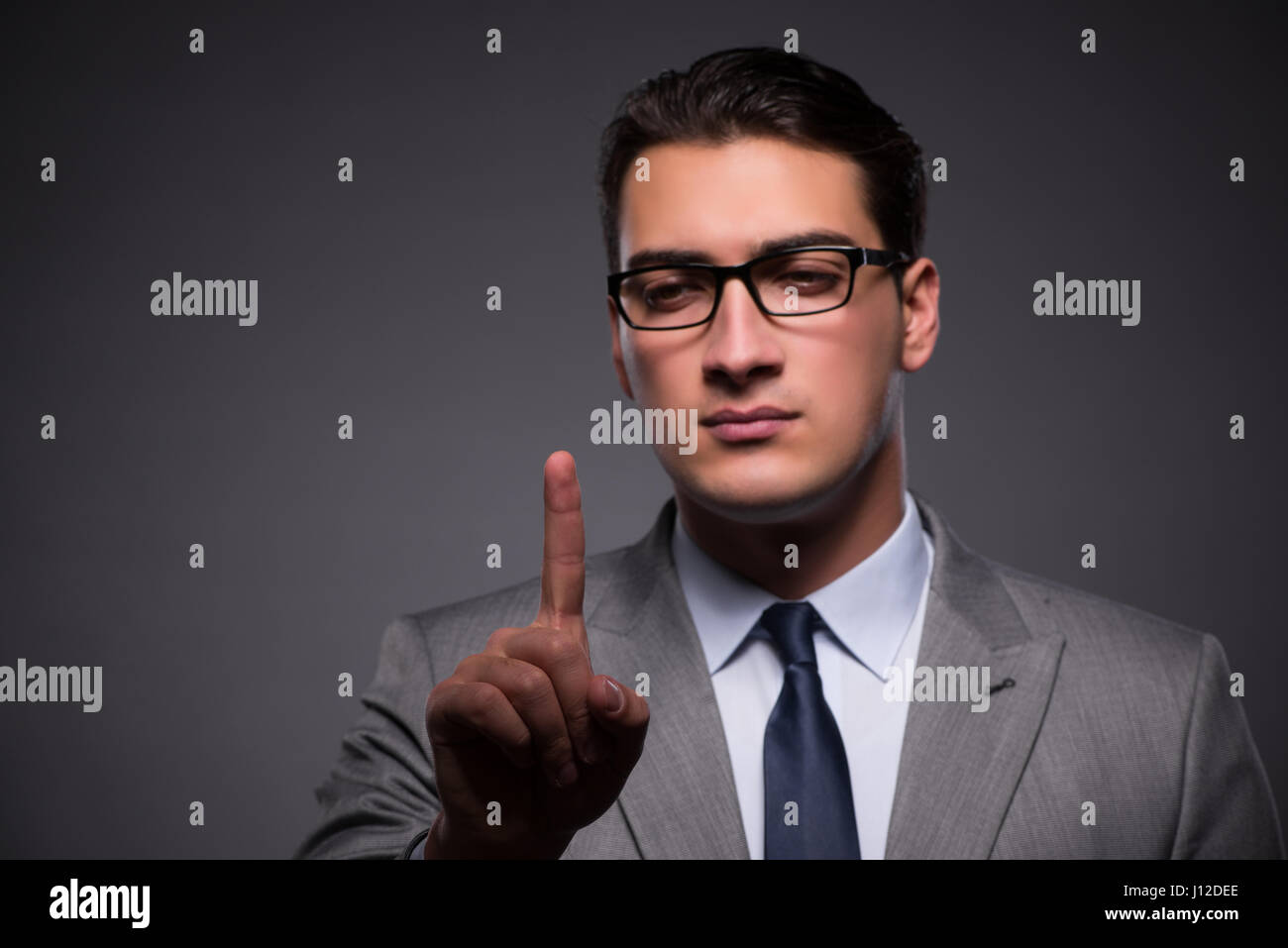 Handsome businessman pressing virtual buttons Stock Photo - Alamy