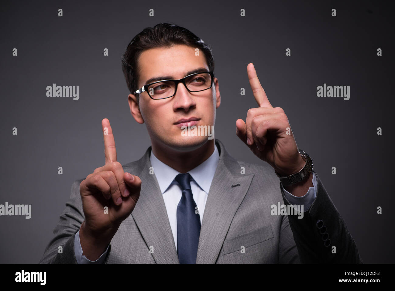 Handsome businessman pressing virtual buttons Stock Photo - Alamy Handsome businessman pressing virtual buttons Stock Photo - Alamy