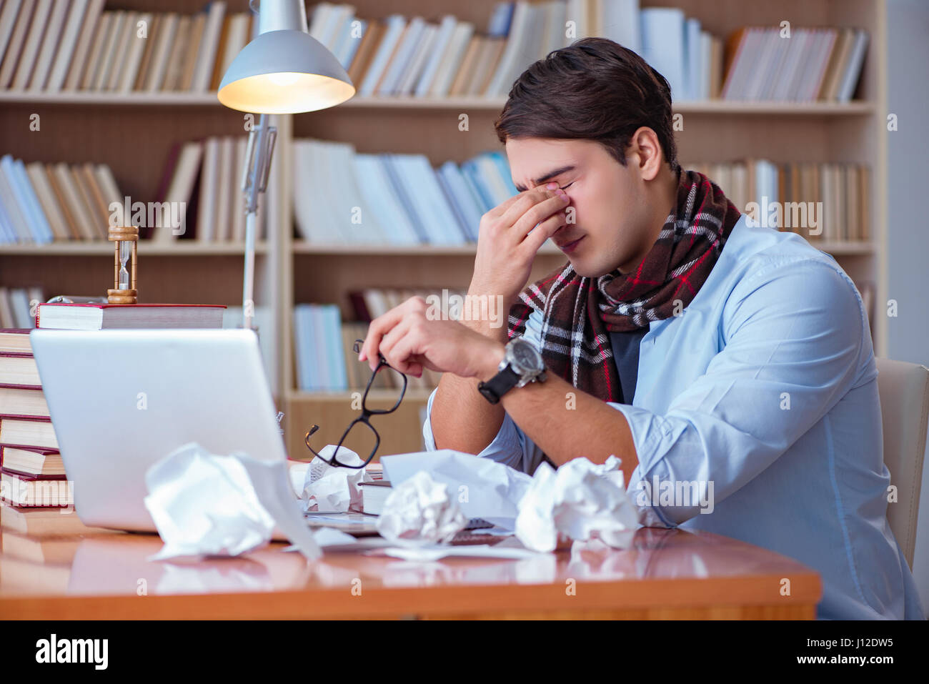 Young book writer writing in library Stock Photo - Alamy