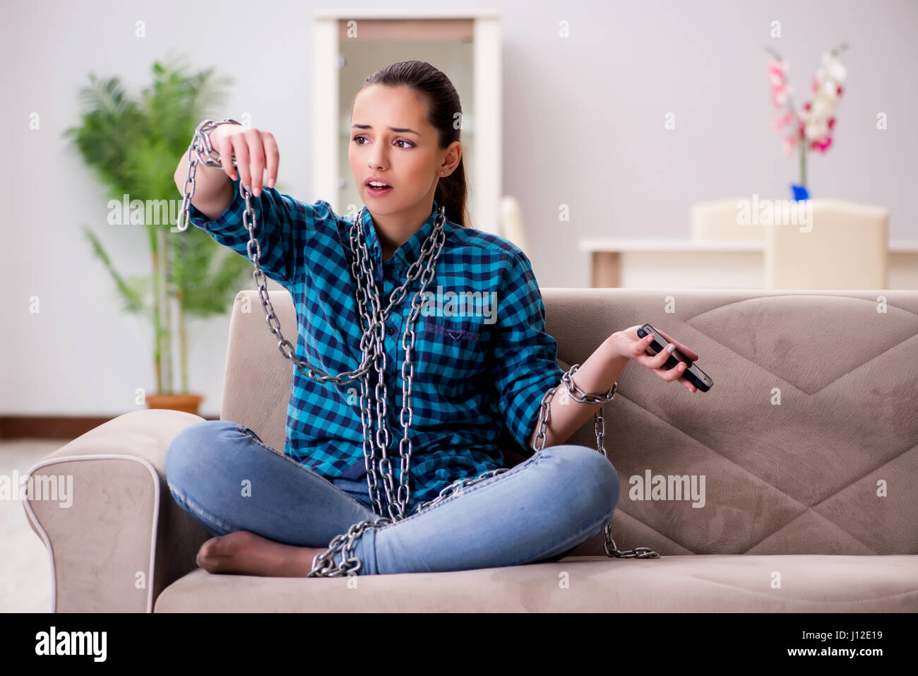 Young girl addicted to mobile phone Stock Photo - Alamy