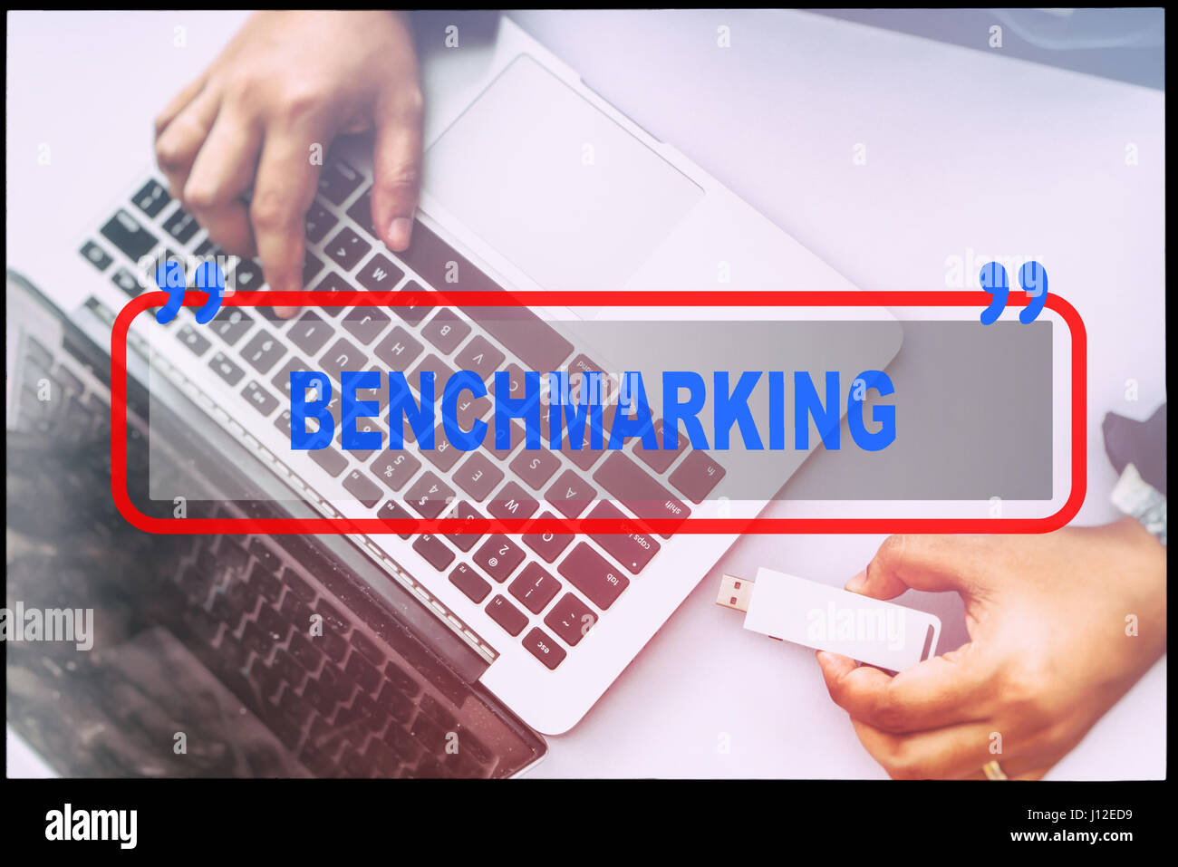 Hand and text "BENCHMARKING" with vintage background. Technology ...