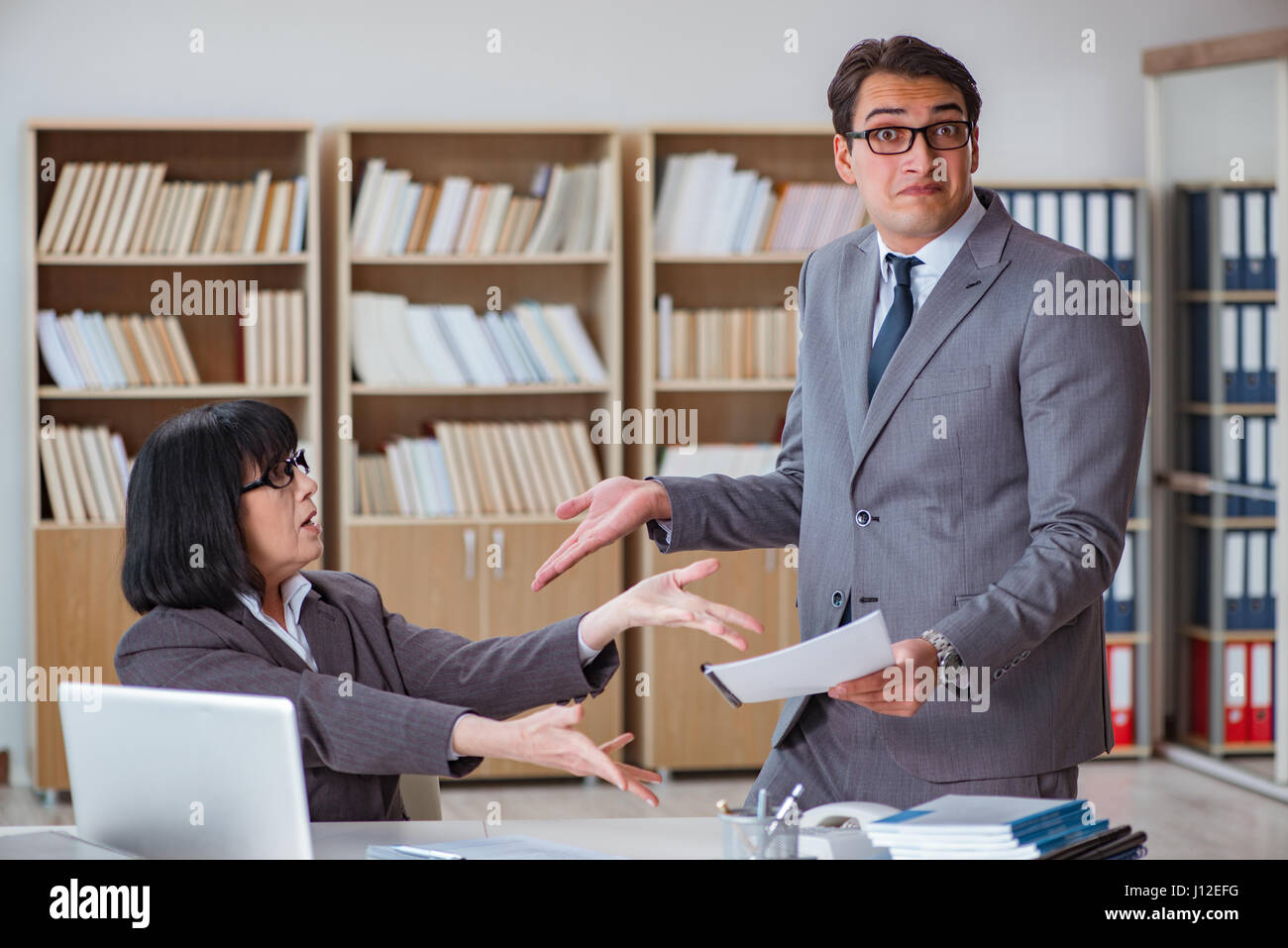 Angry boss reprimanding fellow employee Stock Photo - Alamy